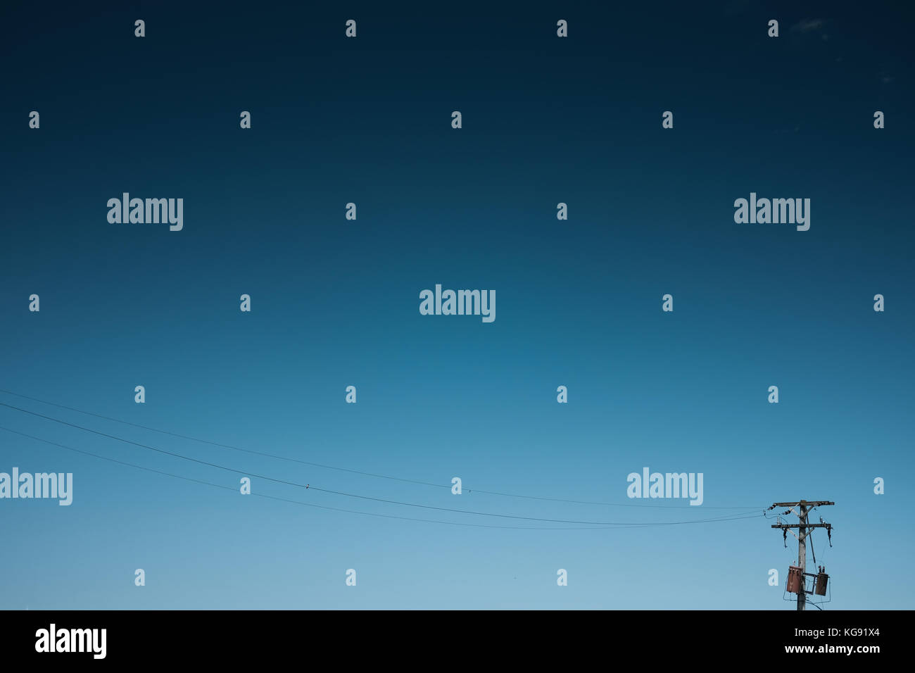 Clear blue sky with power line in rural Wisconsin Stock Photo - Alamy