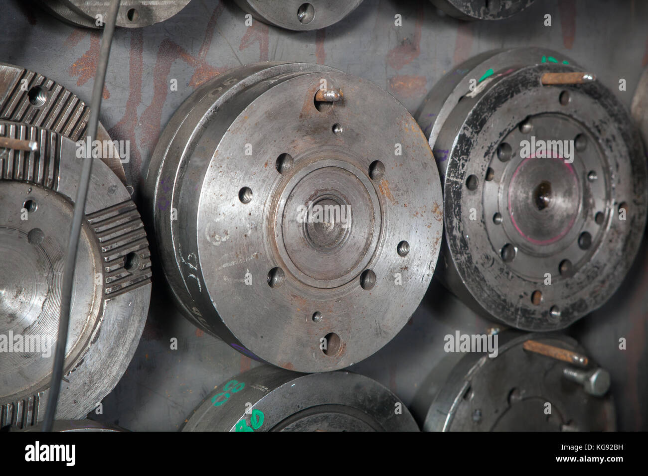 A close-up of an industrial machine made of mettalic round parts in a ...