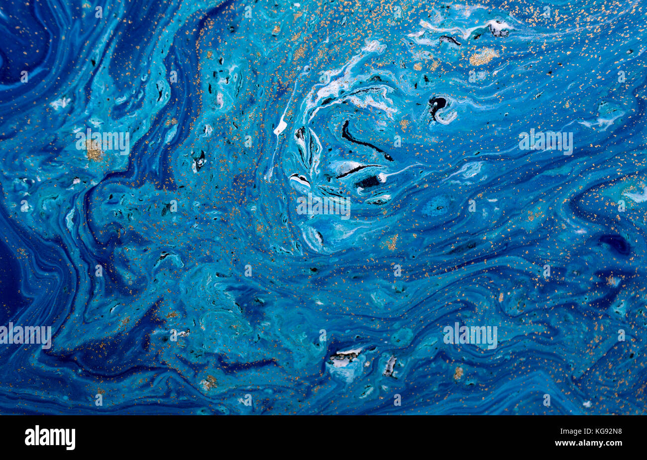 Marbled blue abstract background with golden sequins. Liquid marble ink ...