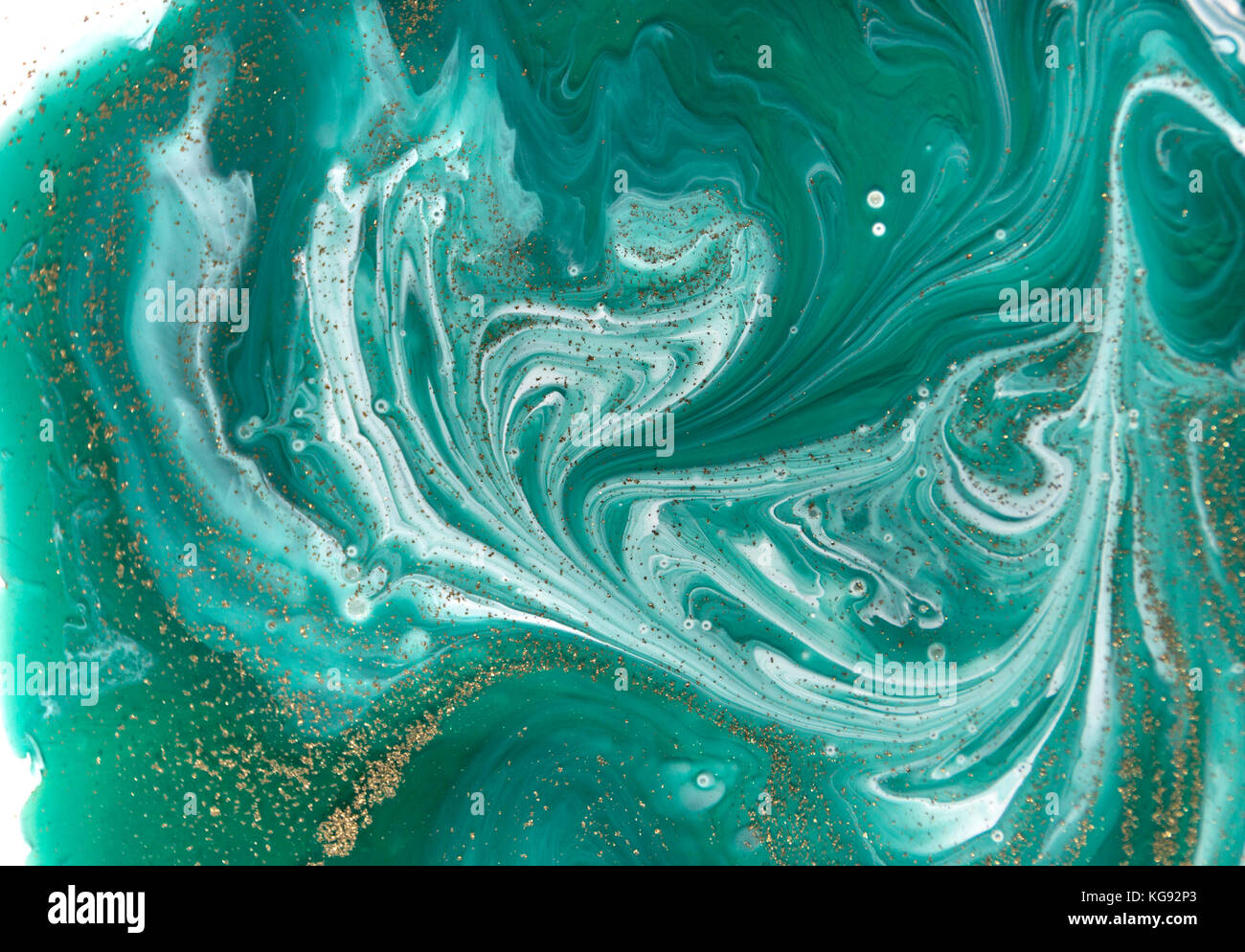 Marbled green abstract background with golden sequins. Liquid marble ...