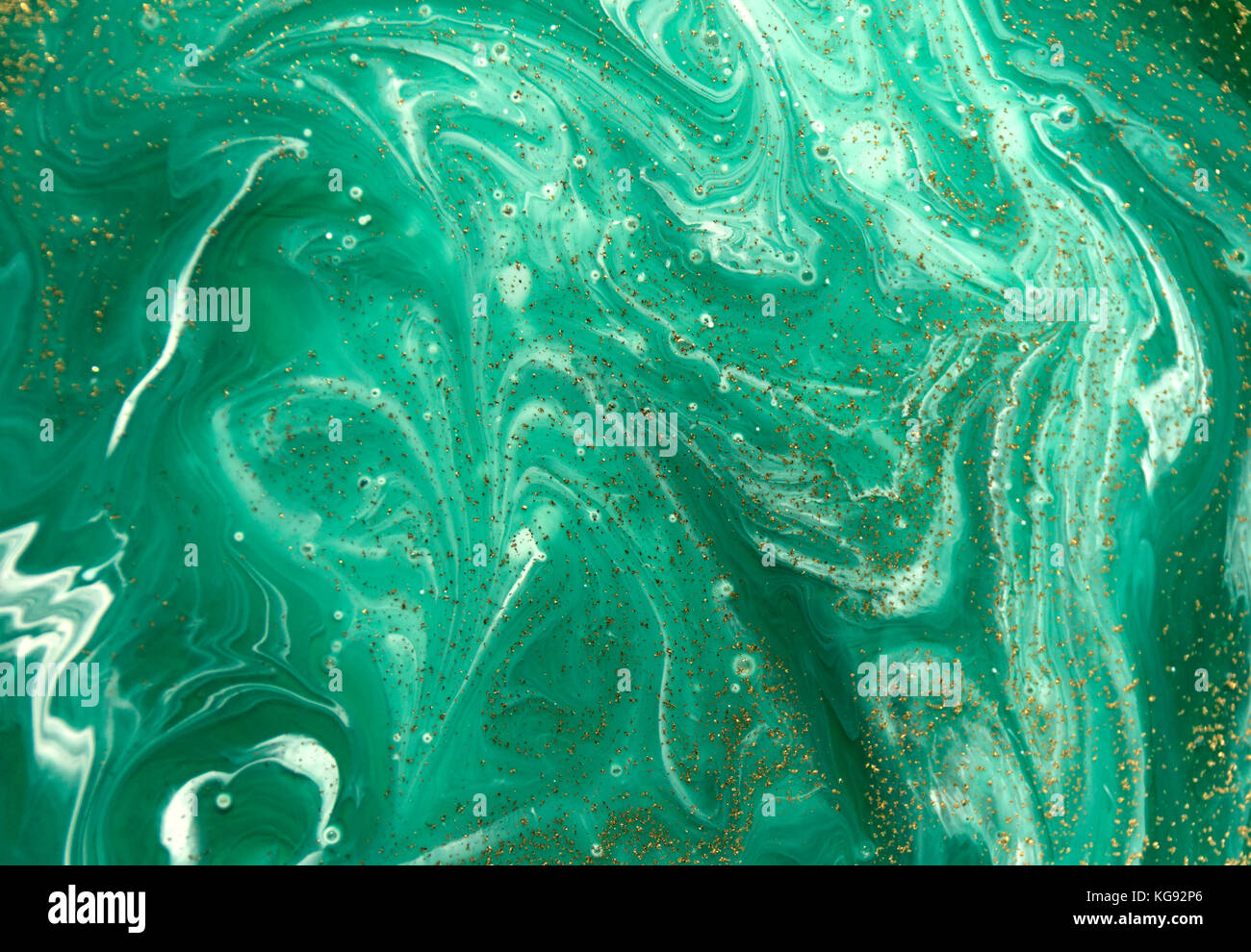 Marbled green abstract background with golden sequins. Liquid marble ...