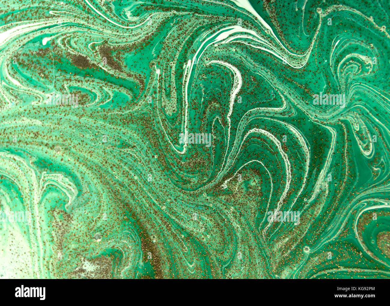 Marbled green abstract background with golden sequins. Liquid marble ...
