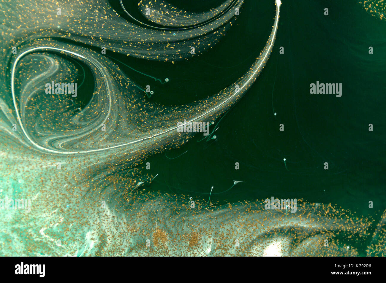 Marbled green abstract background with golden sequins. Liquid marble ...