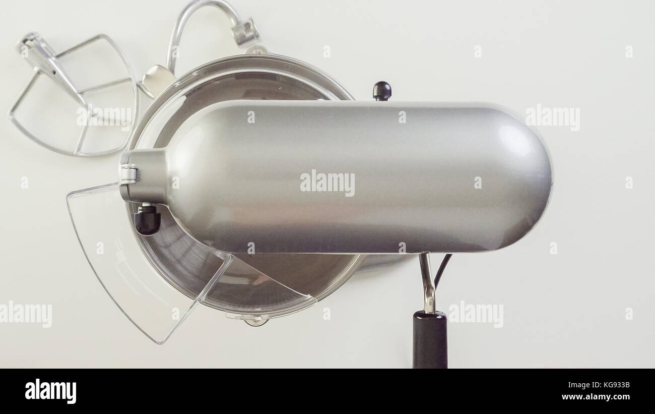 Setting up electric silver food mixer for baking Stock Photo - Alamy