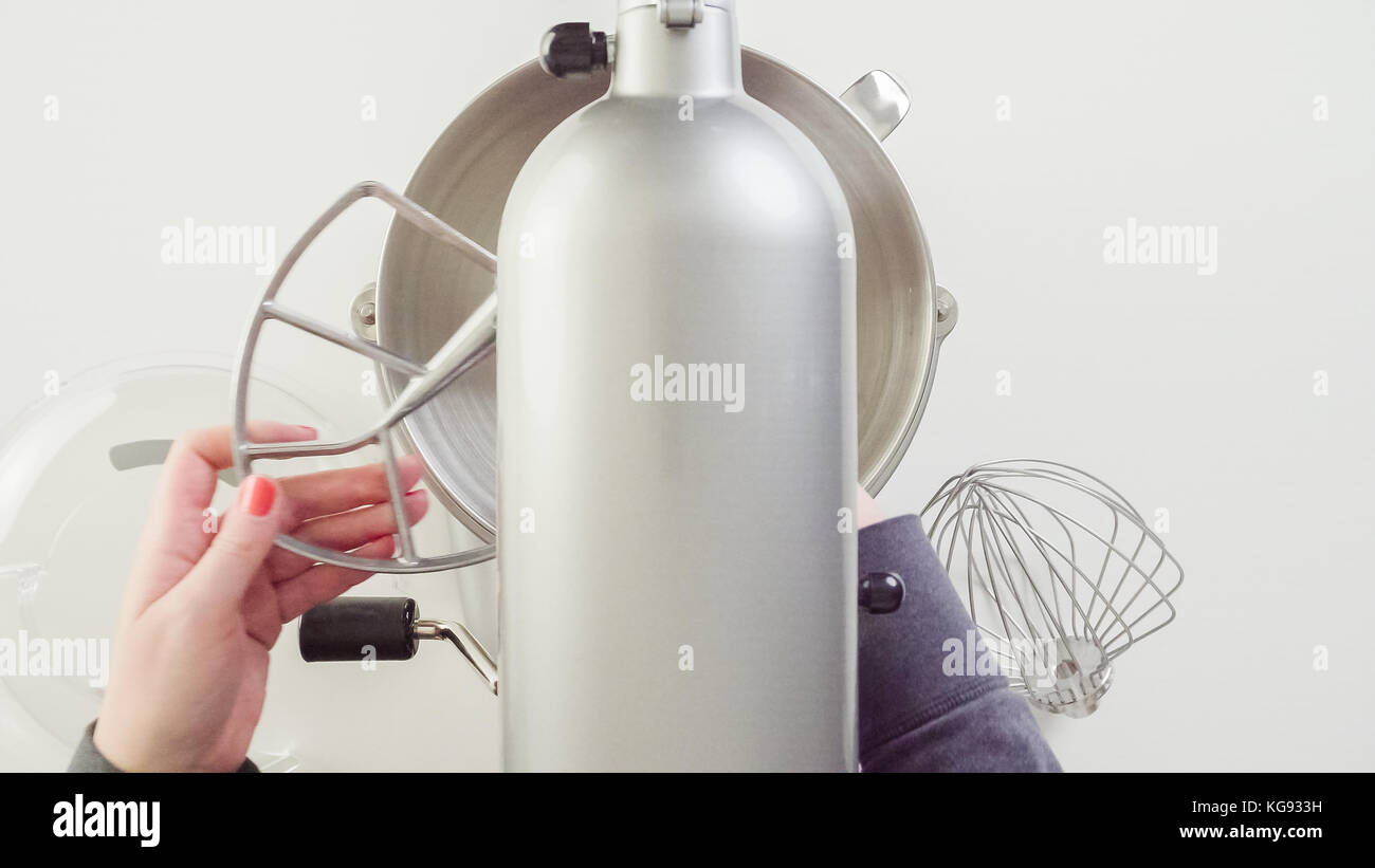 Setting up electric silver food mixer for baking Stock Photo - Alamy