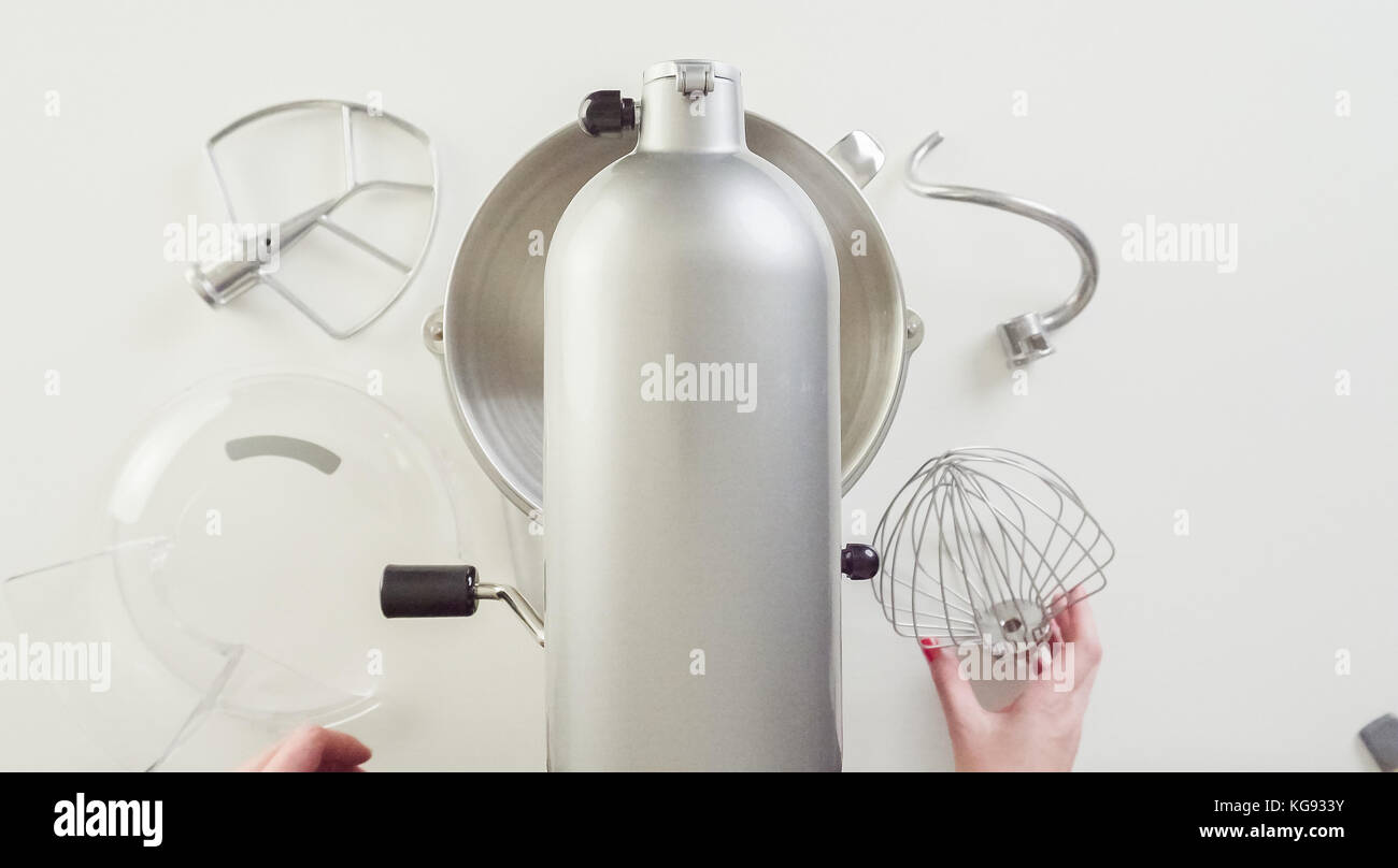 Setting up electric silver food mixer for baking Stock Photo - Alamy