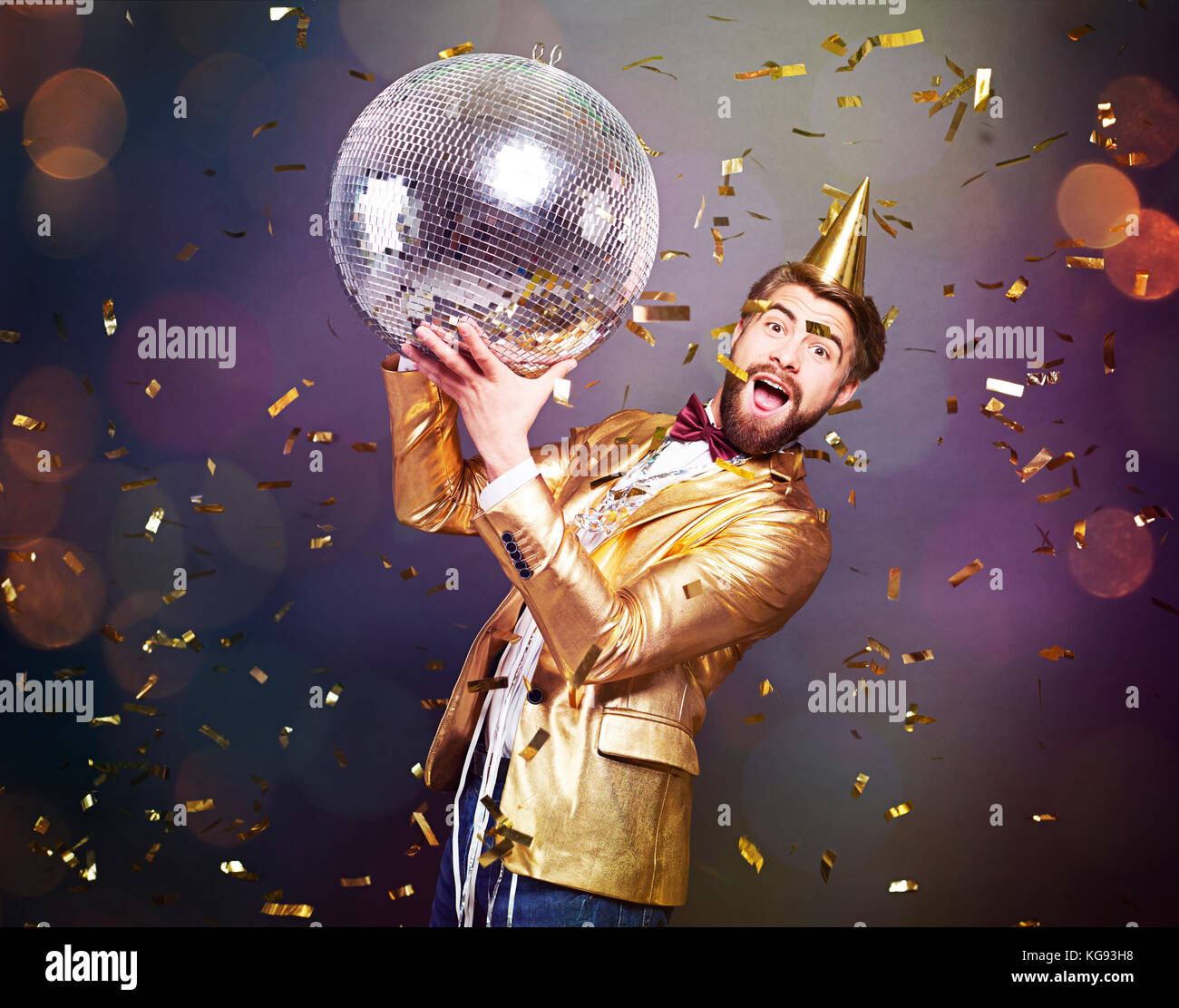 Man with disco ball cheering Stock Photo - Alamy