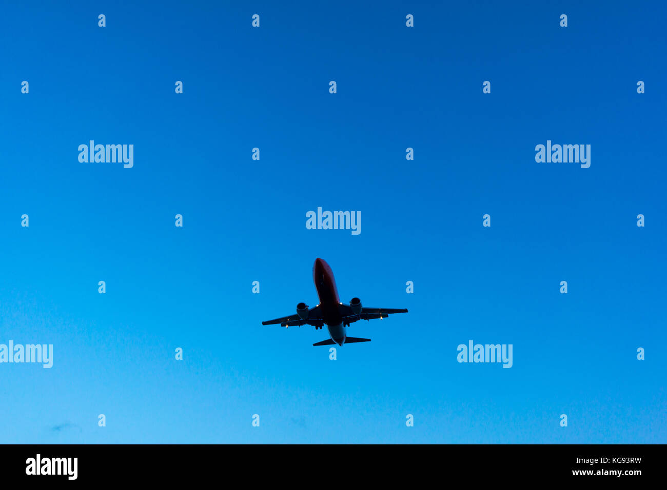 Airliner preparing for landing, view from below Stock Photo - Alamy