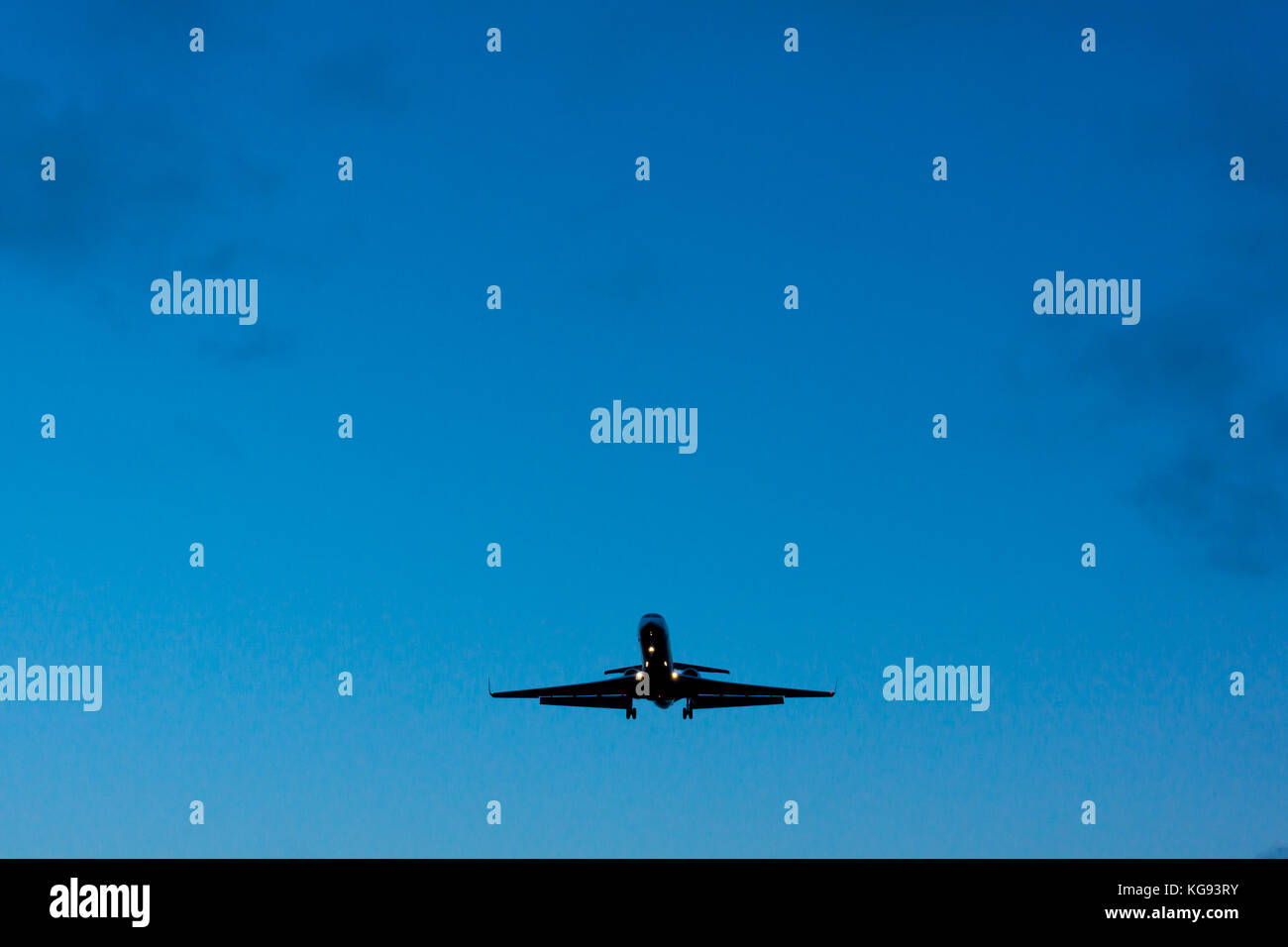 Airliner preparing for landing, view from below Stock Photo - Alamy