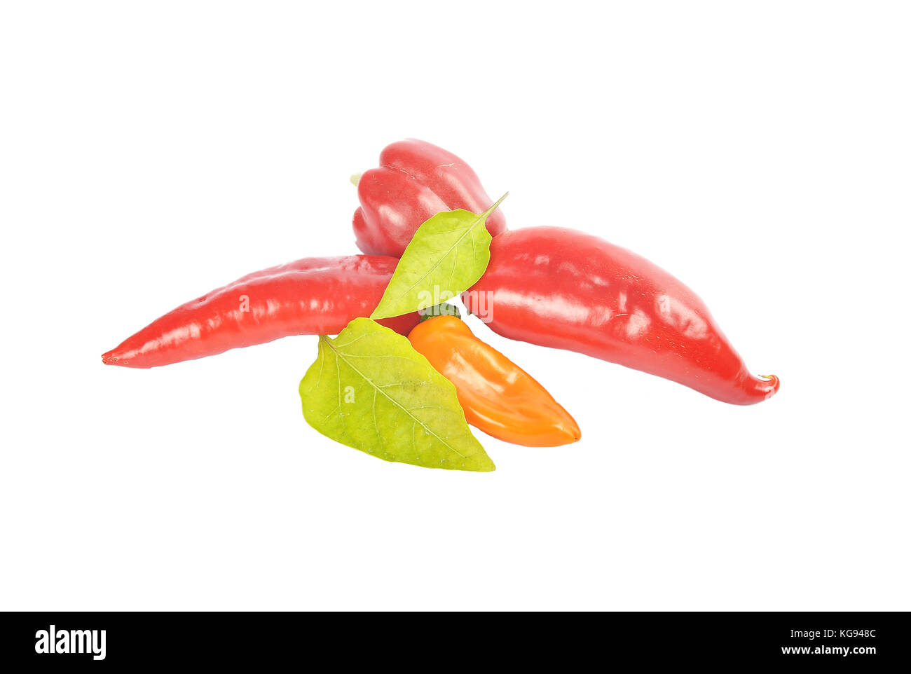 Red ball peppers with leaves isolated Stock Photo - Alamy