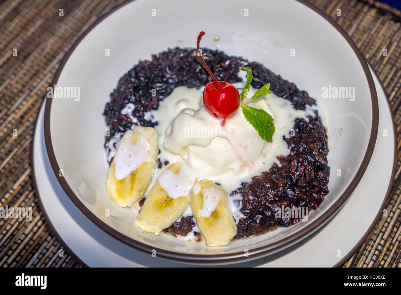 Black rice pudding dessert Stock Photo - Alamy