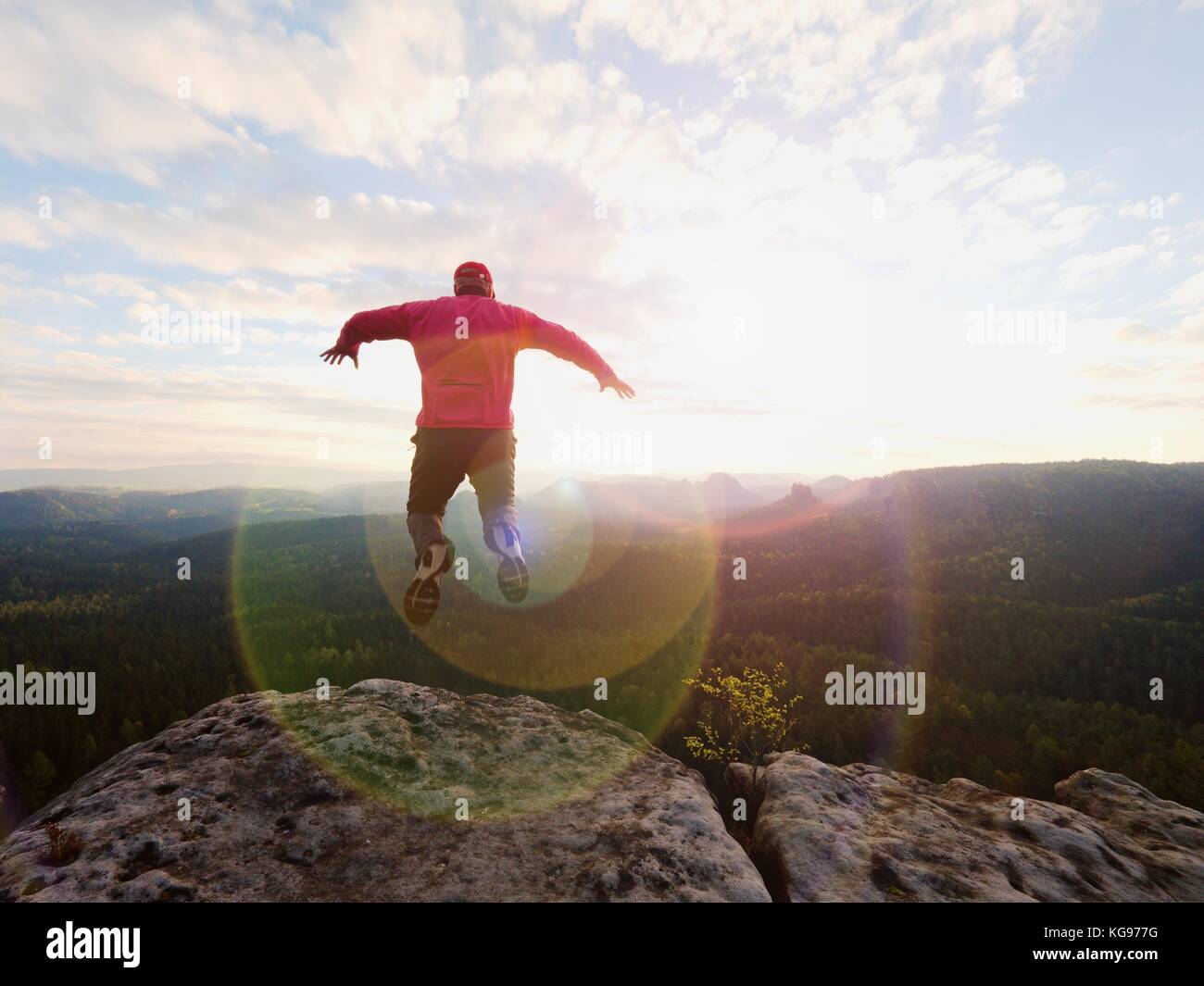 Man dangerously jumping on the edge. Man jump. Young man falling down ...