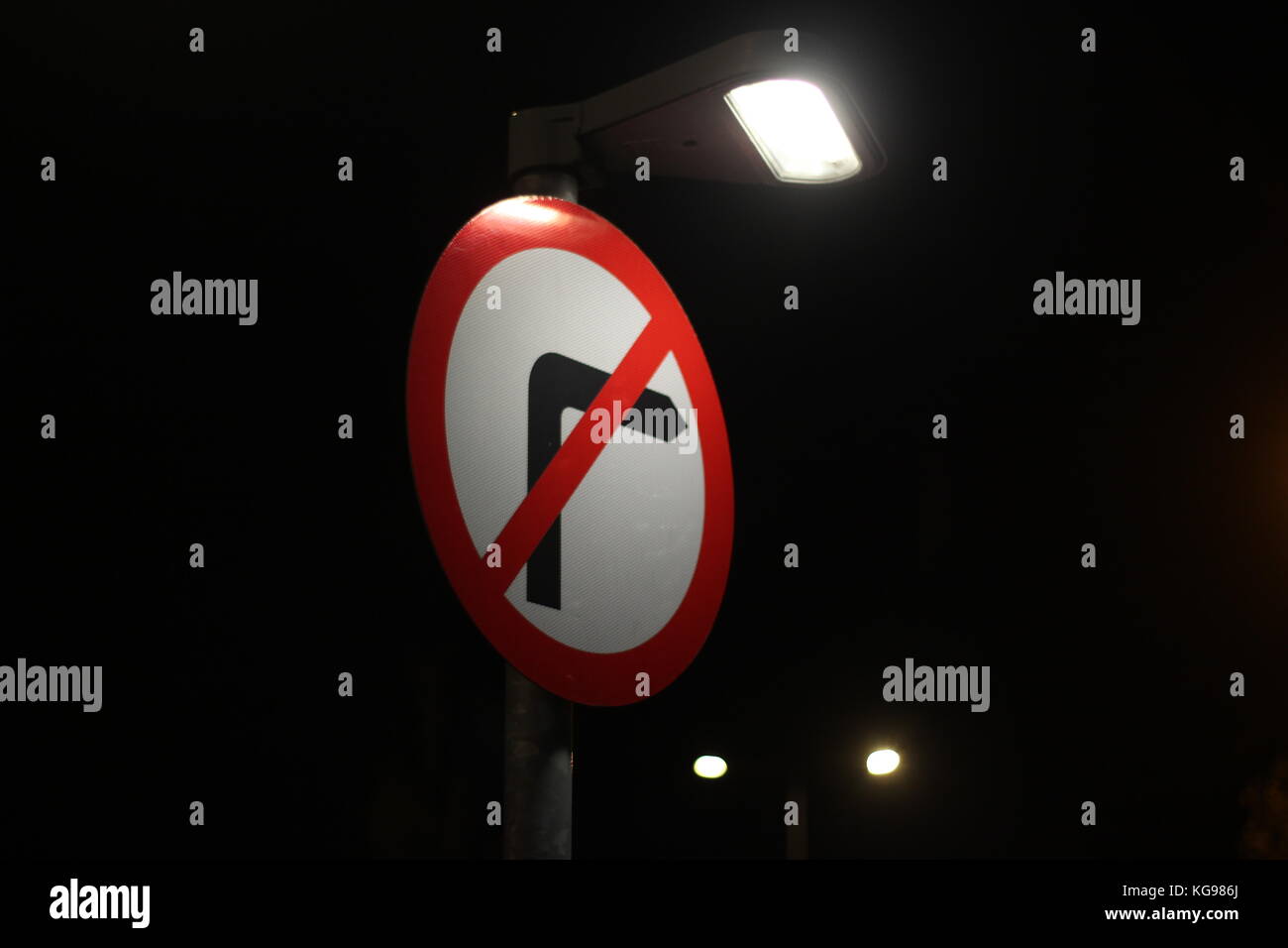 Road signs illuminated at night Stock Photo - Alamy