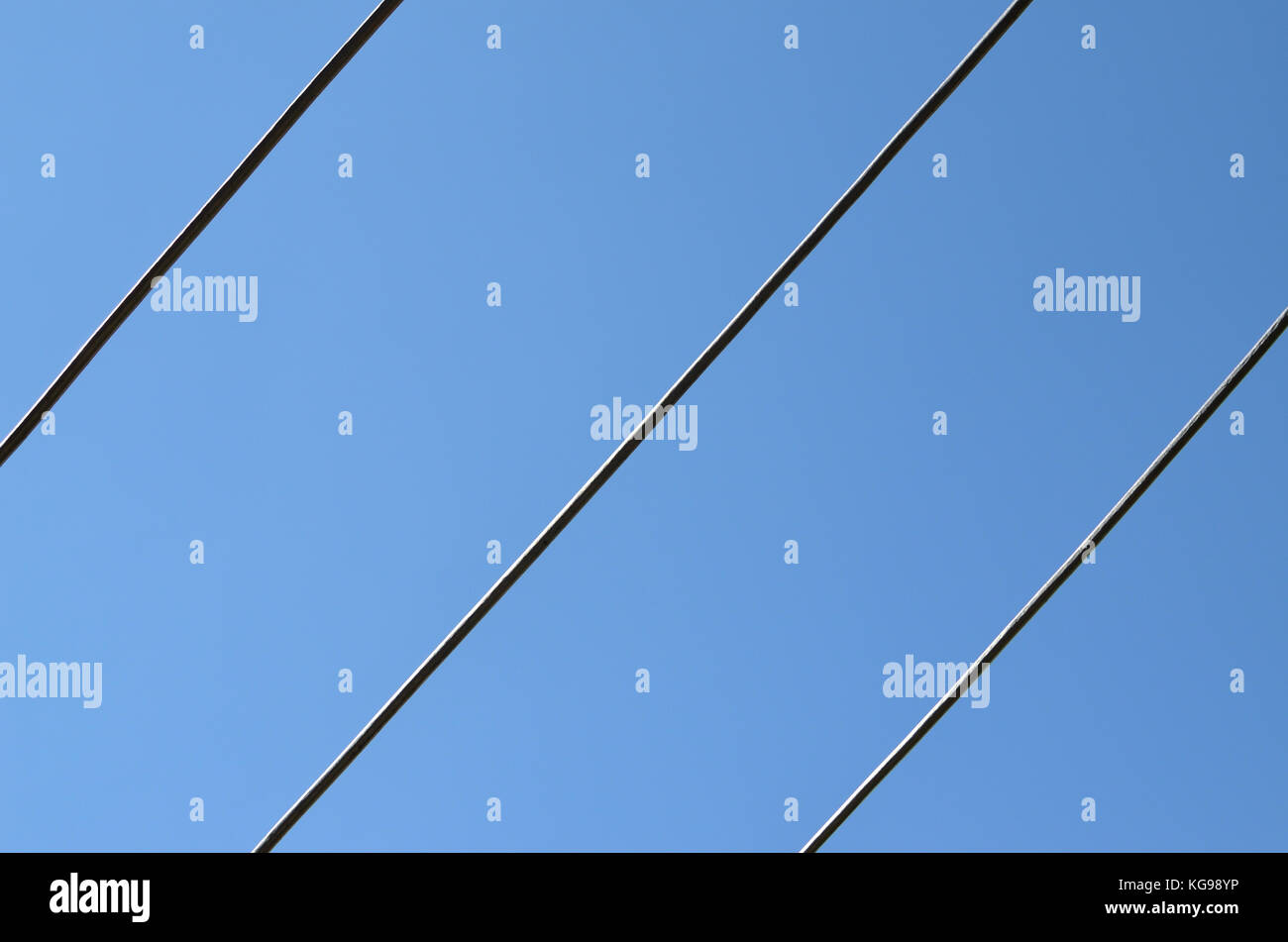 Diagonal iron bars against clear blue sky Stock Photo - Alamy