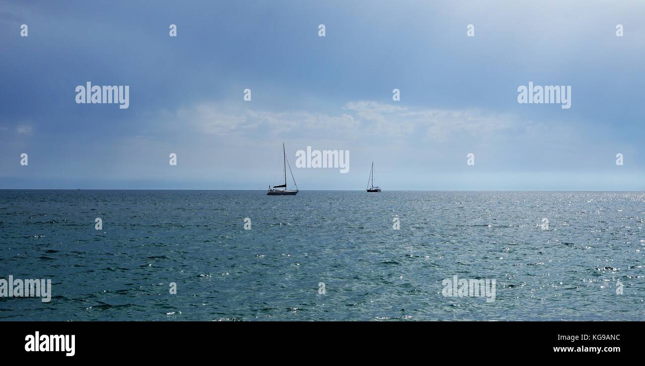 Two sailboats in ocean Stock Photo - Alamy