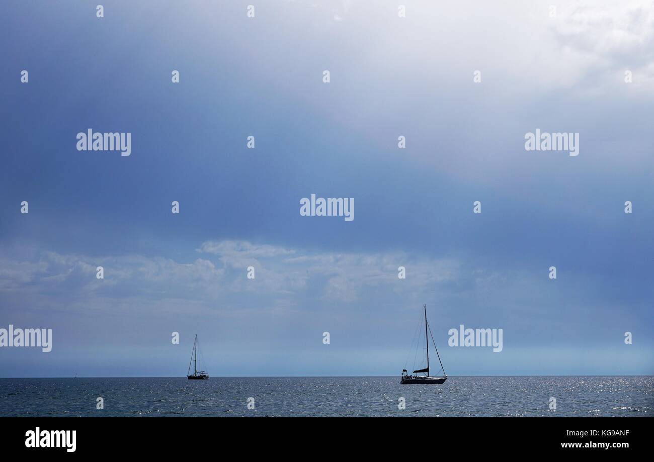 Two sailboats in ocean Stock Photo - Alamy