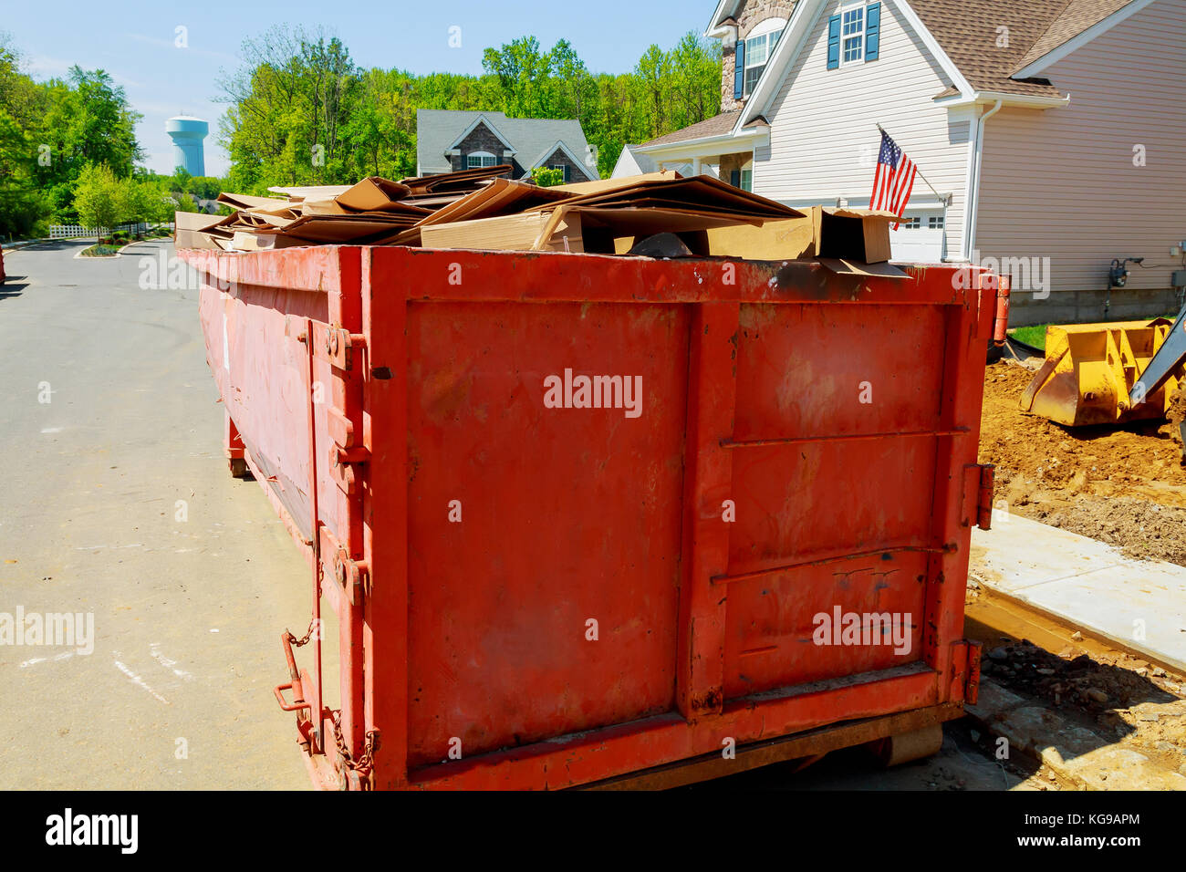 Loaded dumpster near a construction, home renovation Stock Photo - Alamy