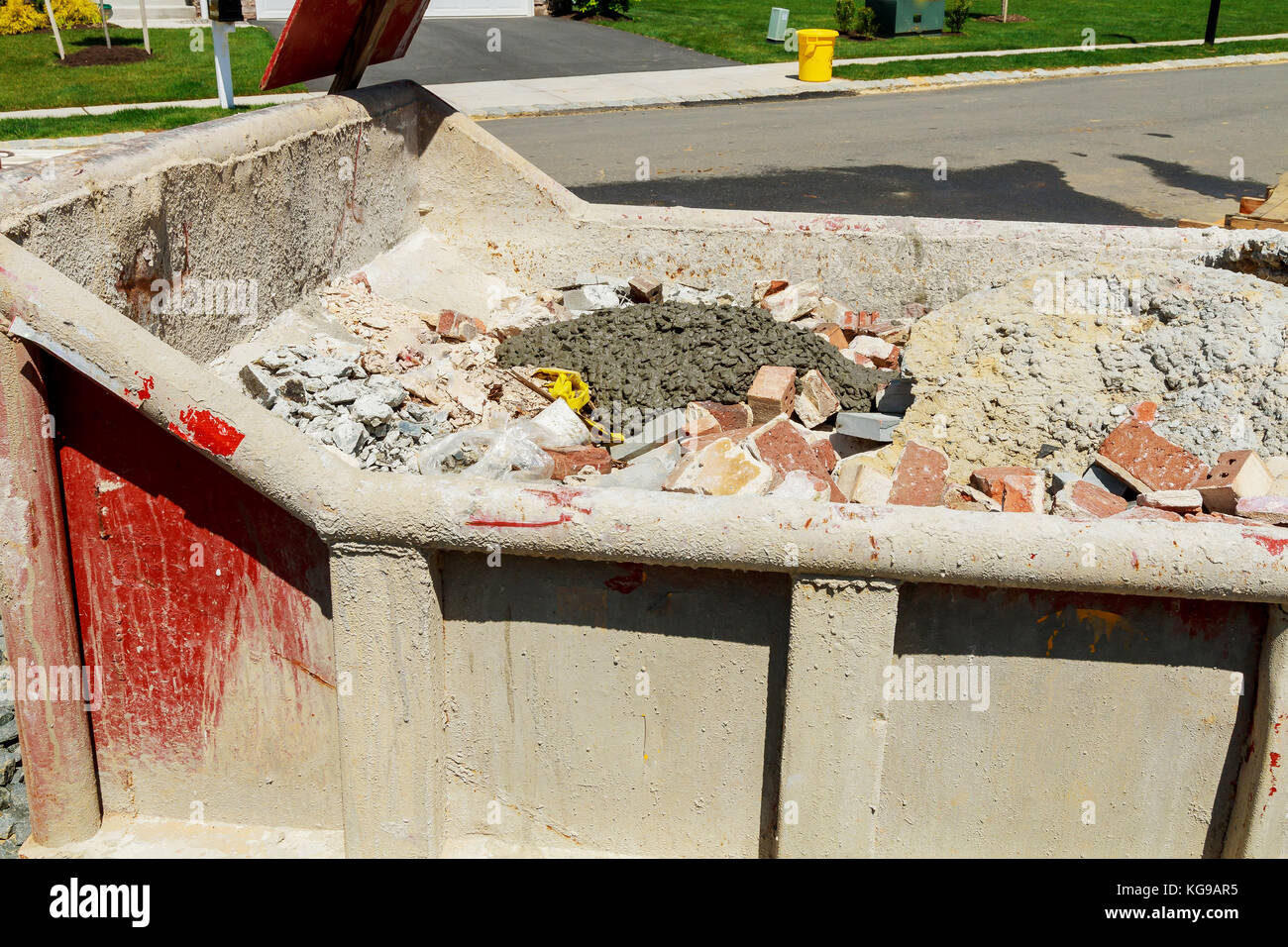 Loaded dumpster near a construction site, home renovation dumpster ...