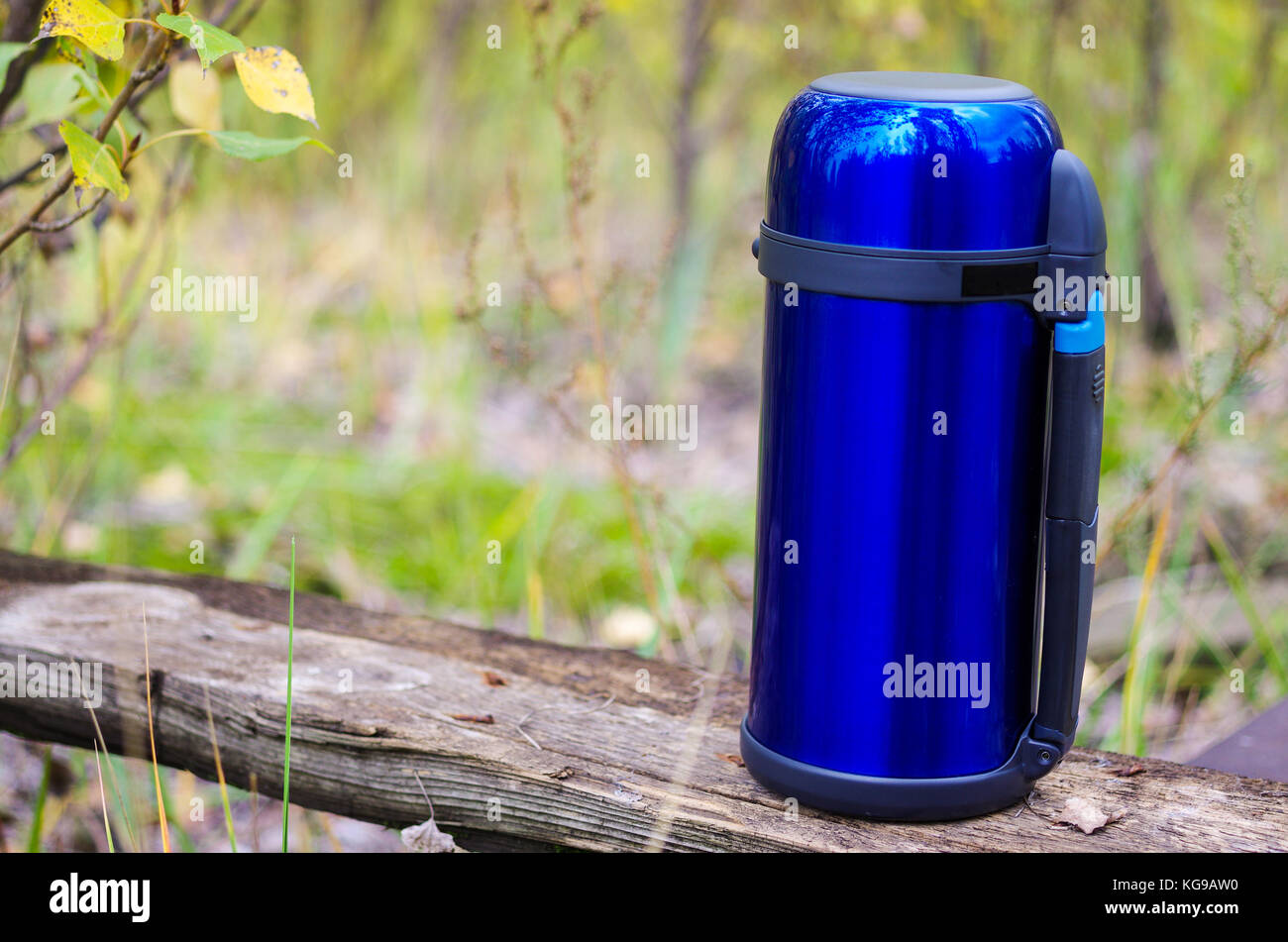 A blue thermos for saving hot drinks Stock Photo - Alamy