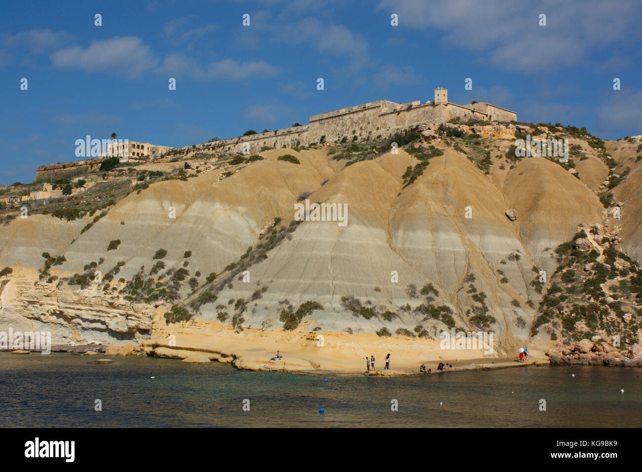 Cliffs at ix-Xatt l-Ahmar, Gozo, Malta, overlooked by Fort Chambray ...