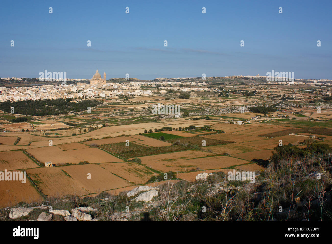 Looking north across a rural valley towards the village of Xewkija in ...
