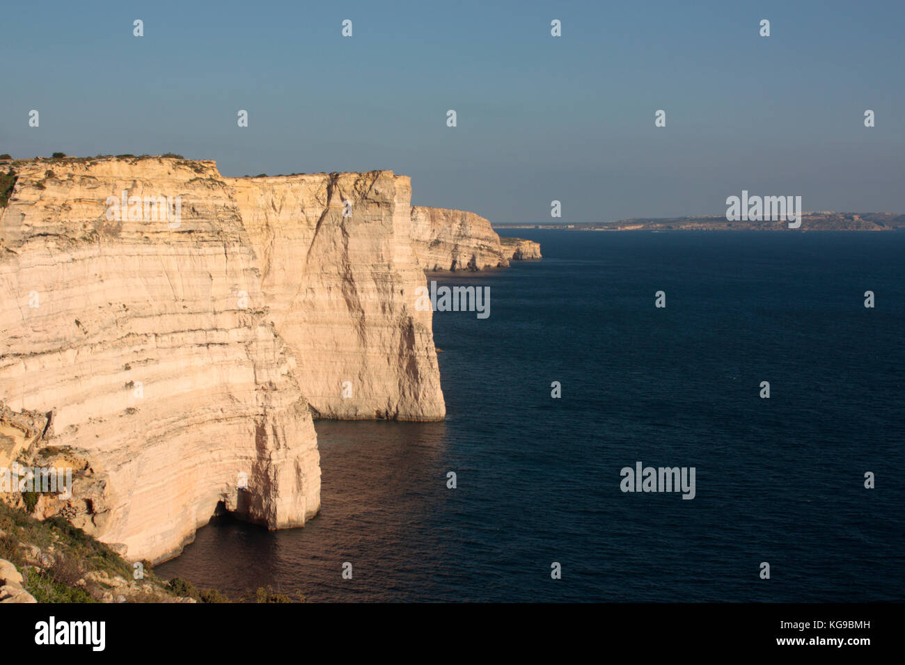 Sanap Cliffs, Gozo, with Comino and Malta visible in the distance Stock ...