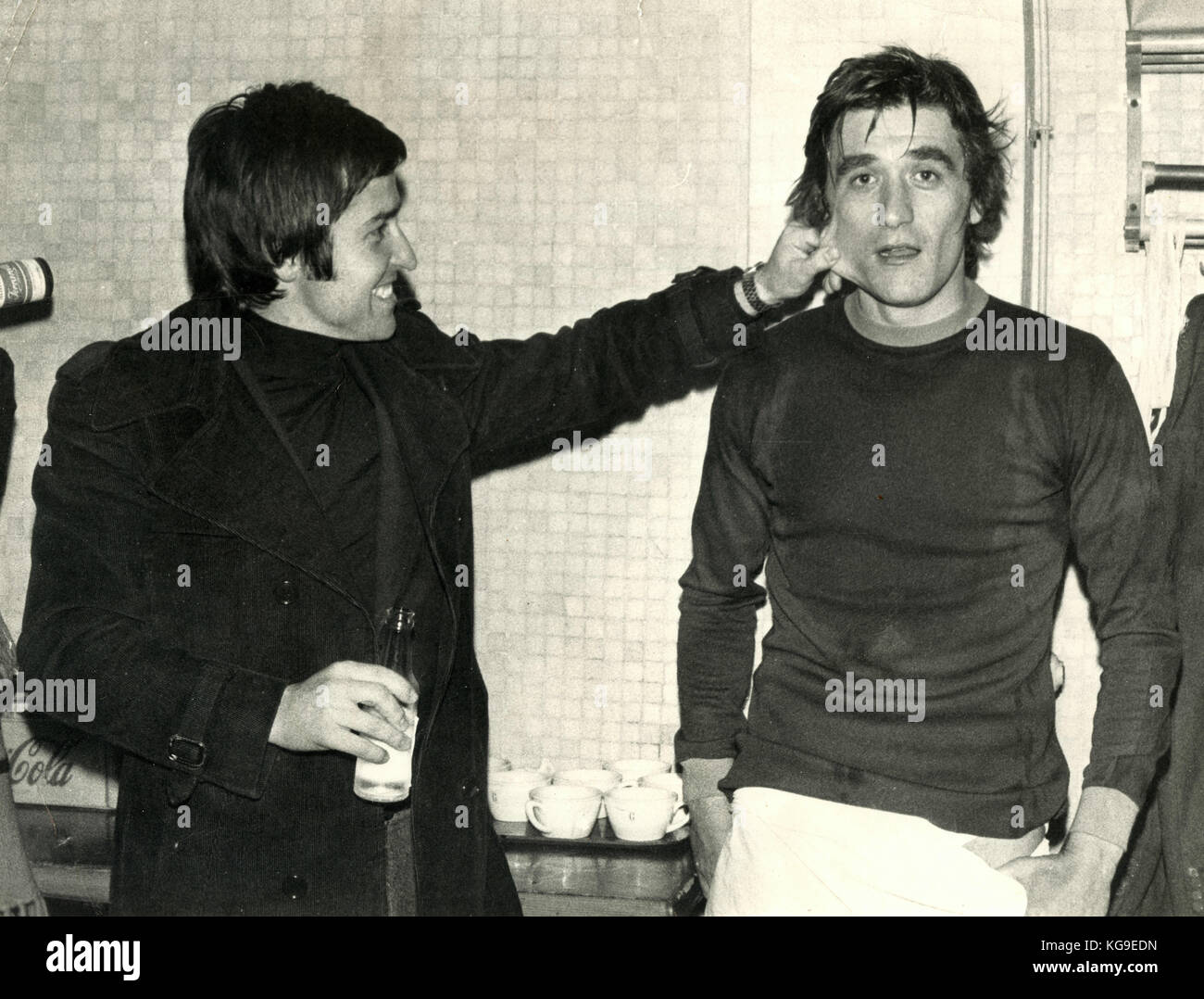 Italian football player Giancarlo De Sisti teases another player Stock ...