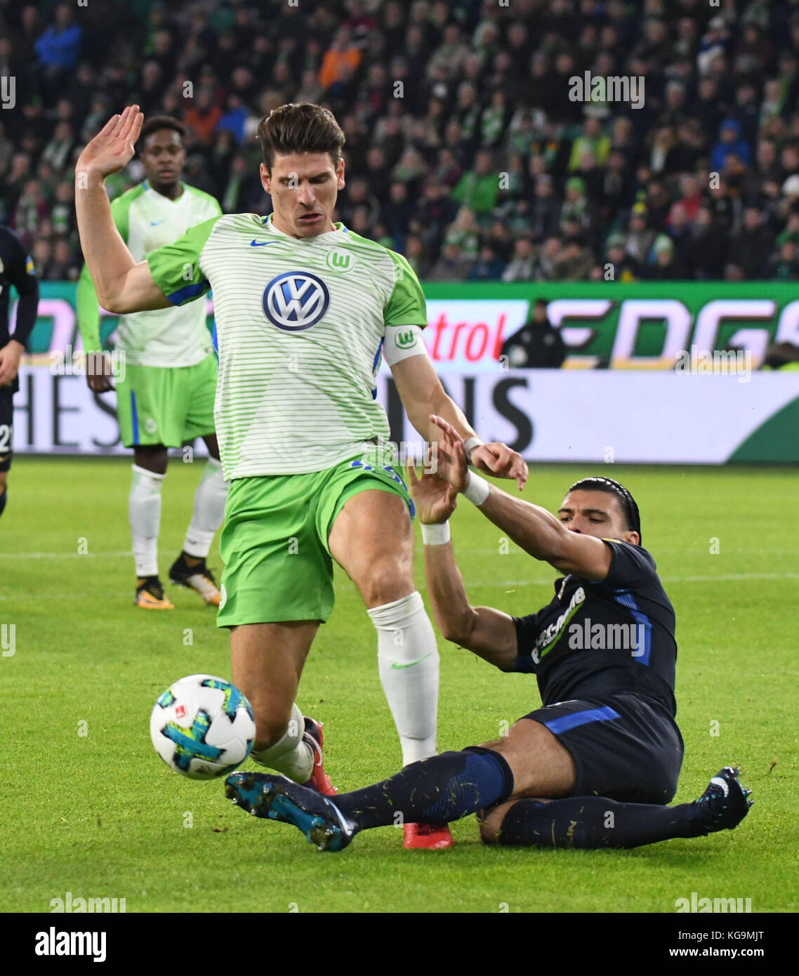 Wolfsburg's Mario Gomez and Berlin's Karim Rekik in action during the ...