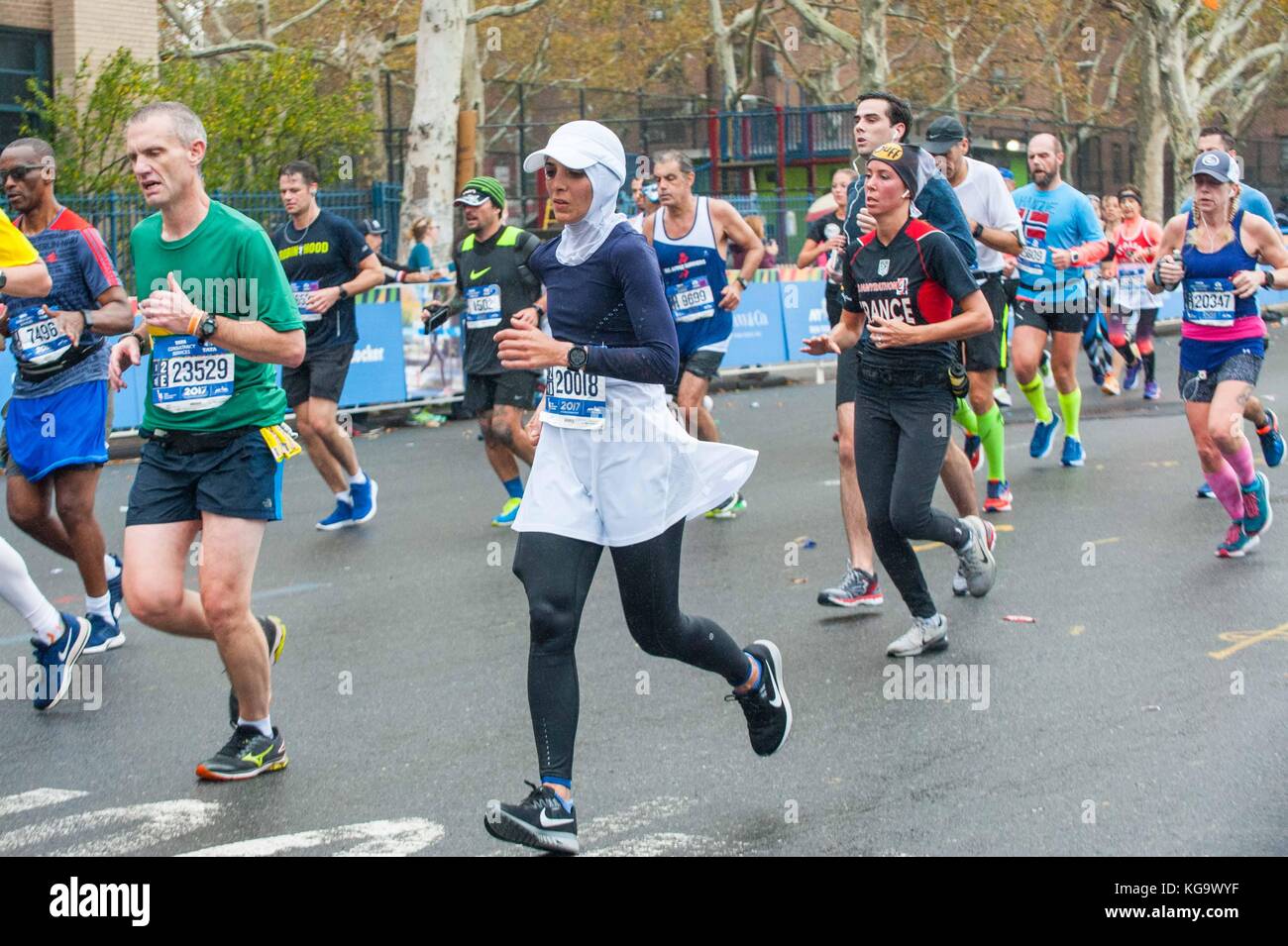New York, USA. 5th Nov, 2017. A Muslim female wearing a hijab runs in ...