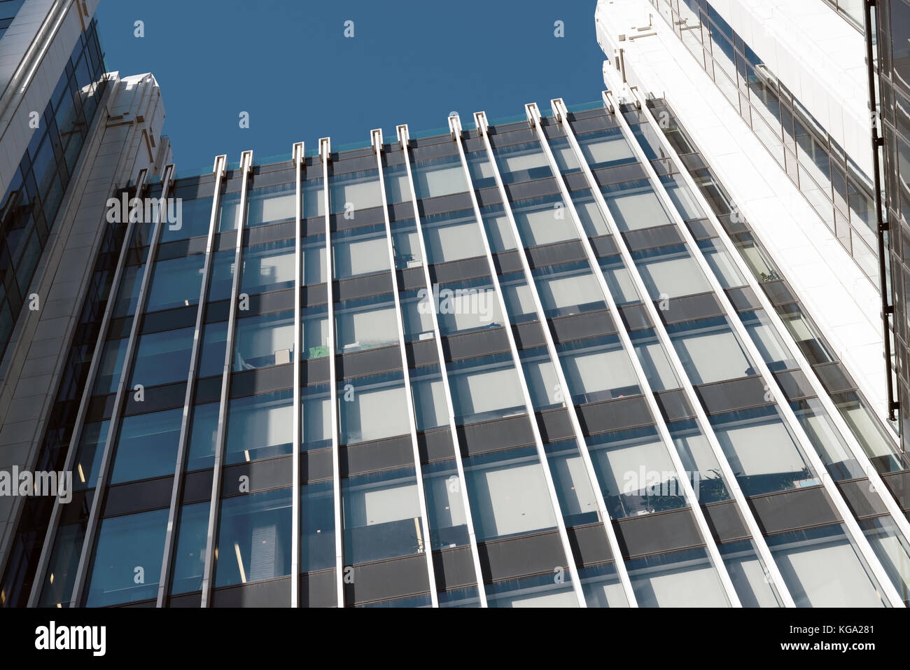 View from below on glass office buildings Stock Photo - Alamy