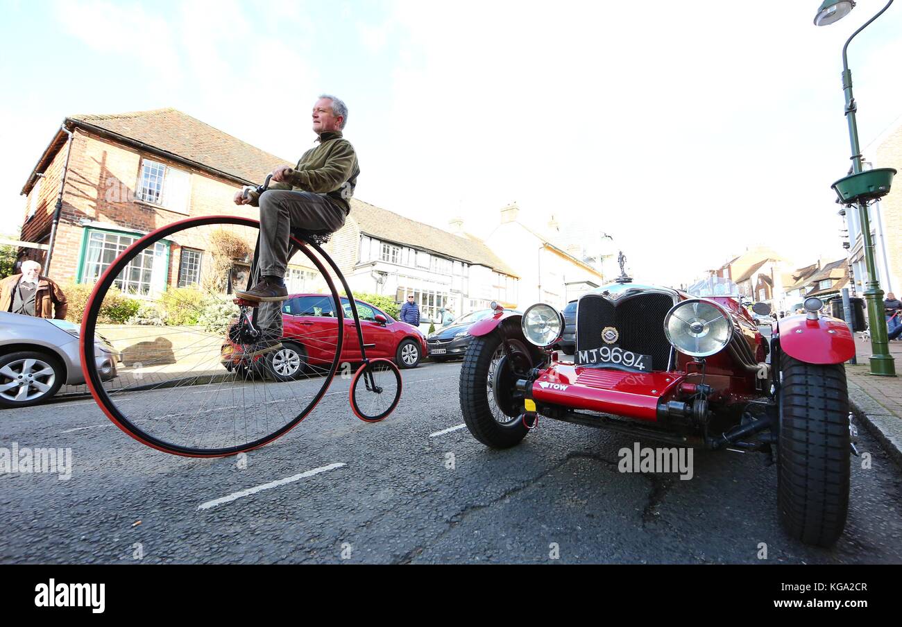 A man on a Penny Farthing rides down Cuckfield high street during the ...
