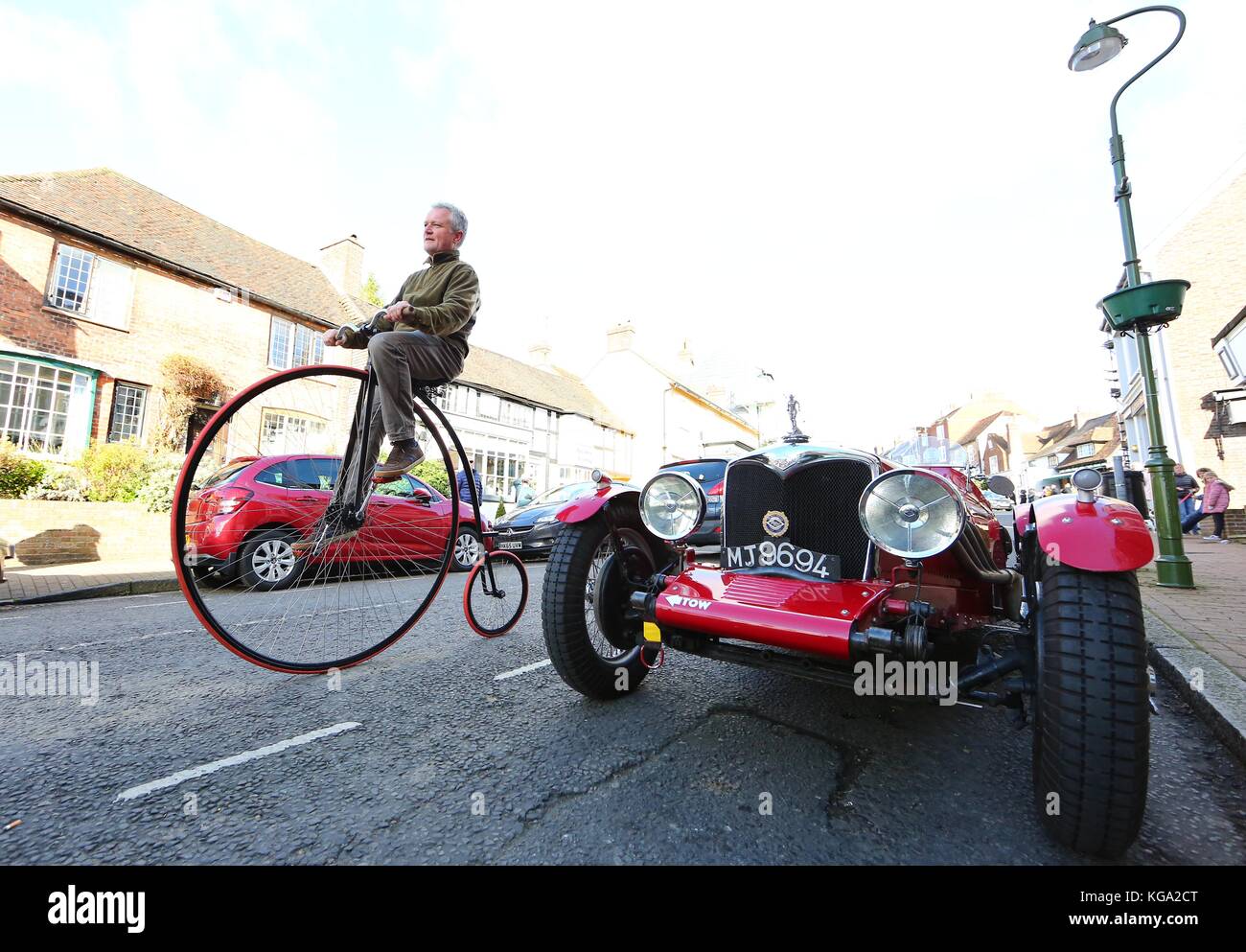 A man on a penny Farthing rides down Cuckfield high street during the ...