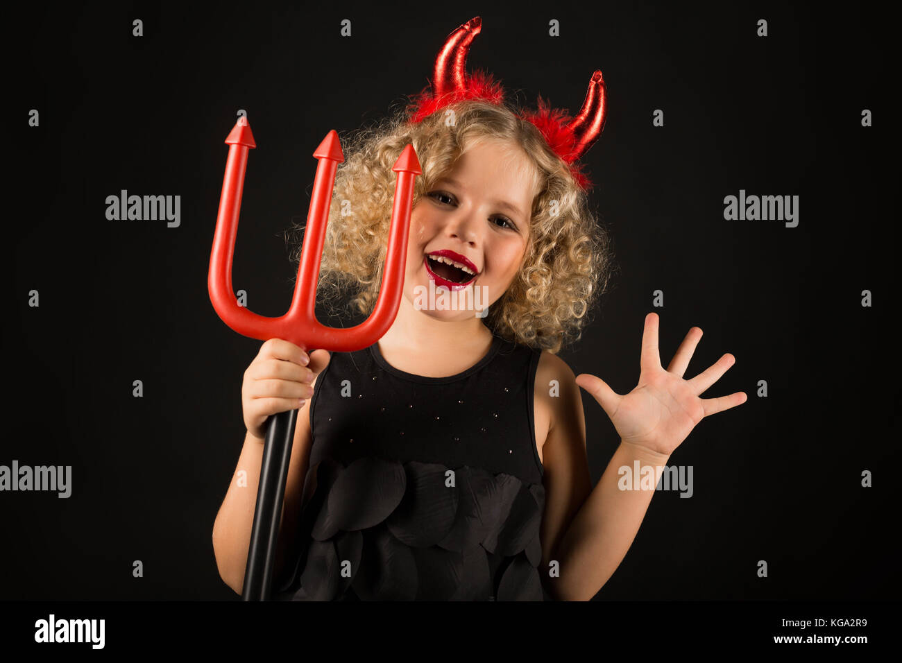 Attractive girl in devils costume Stock Photo - Alamy