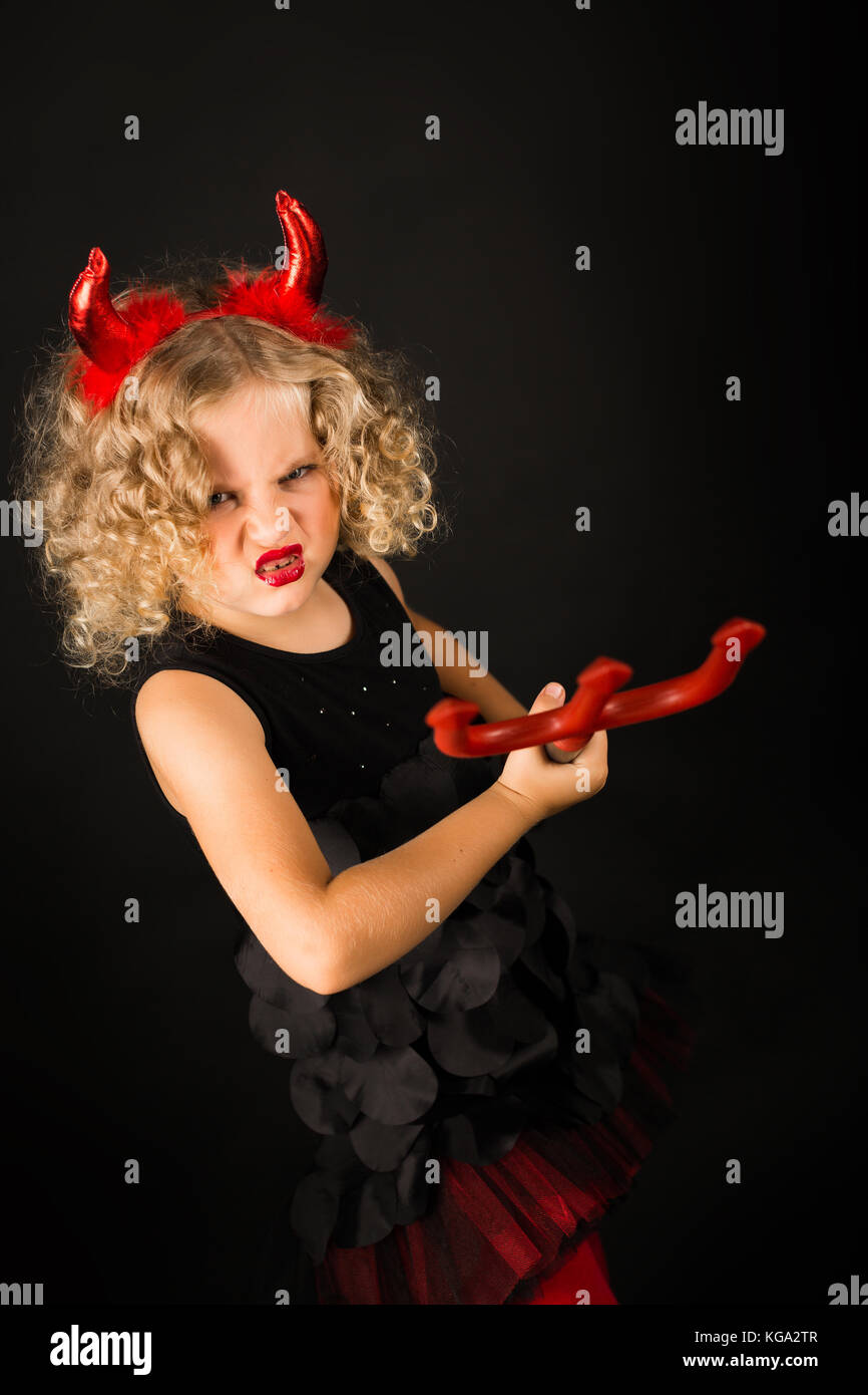 Beautiful girl in devils costume Stock Photo - Alamy