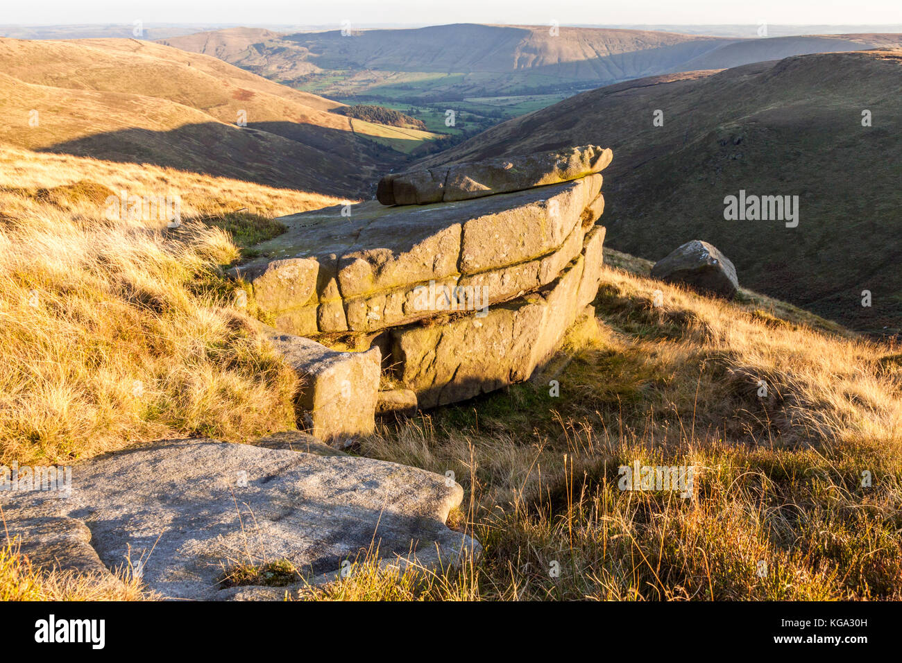 A gritstone outcrop at Crowden Clough on Kinder Scout with the Vale of ...