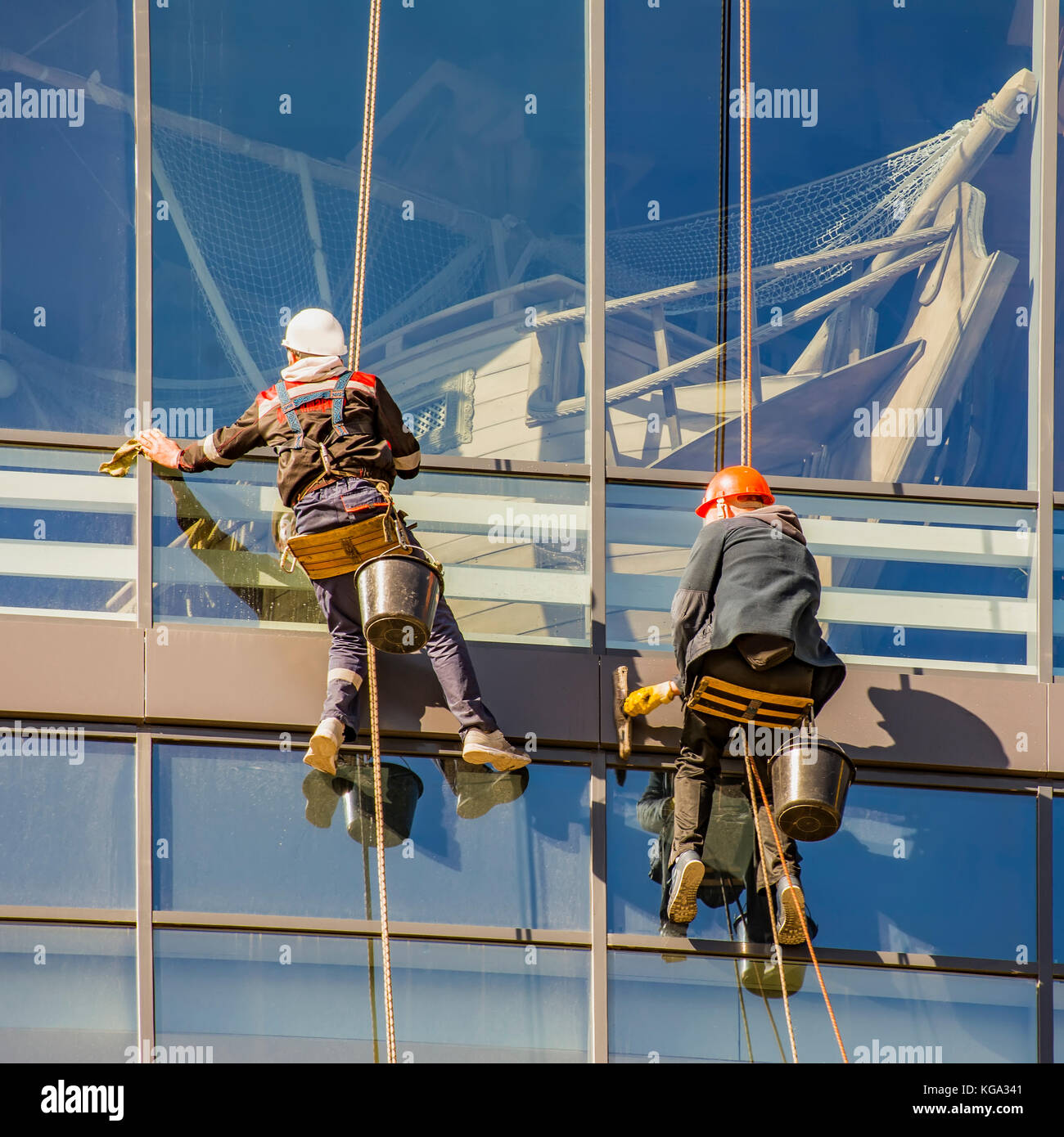 Spiderman washing Windows in high-rise building Stock Photo - Alamy