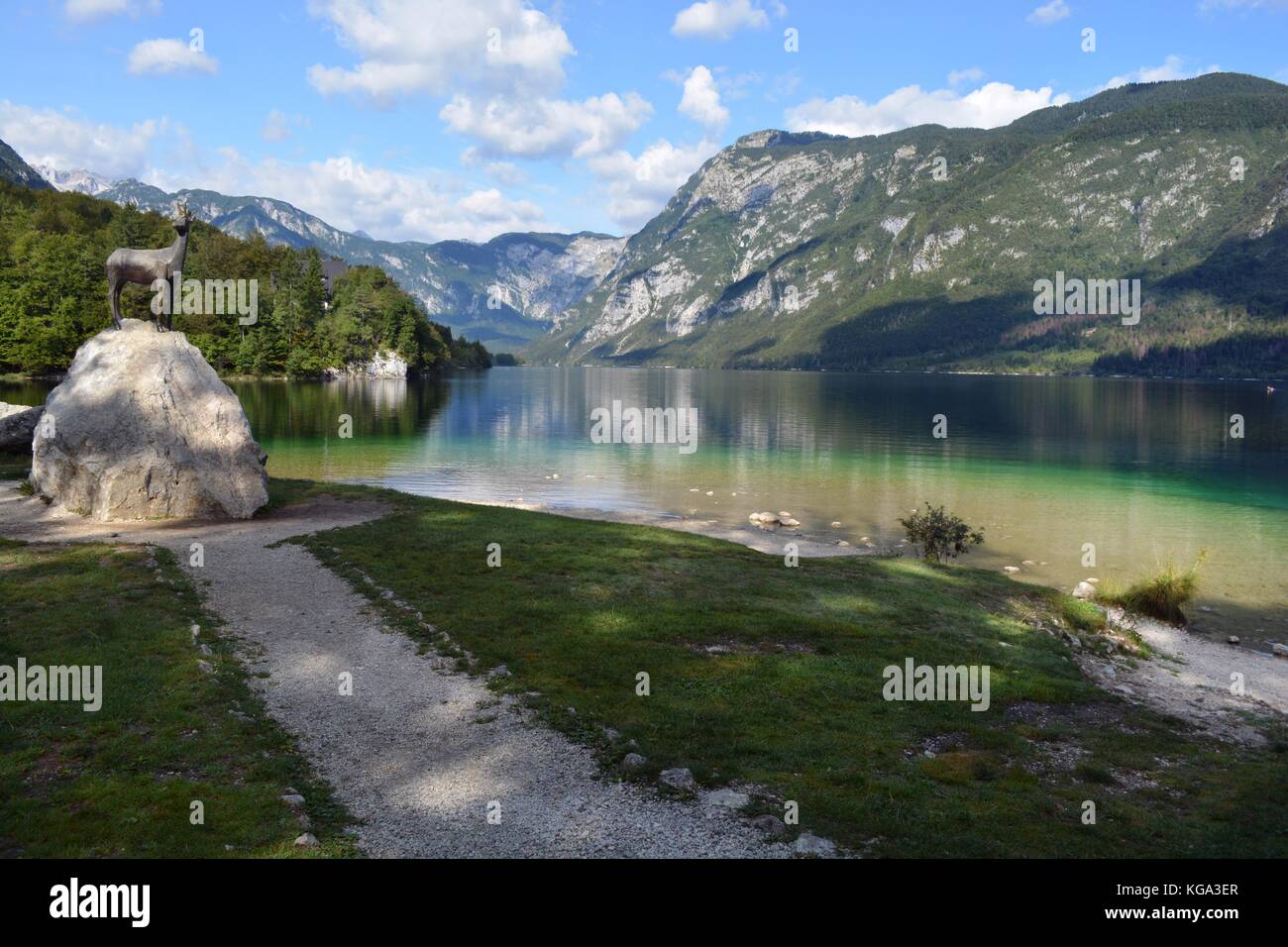 Zlatorog or Golden Horn statue guarding the mountain ridges above Lake ...