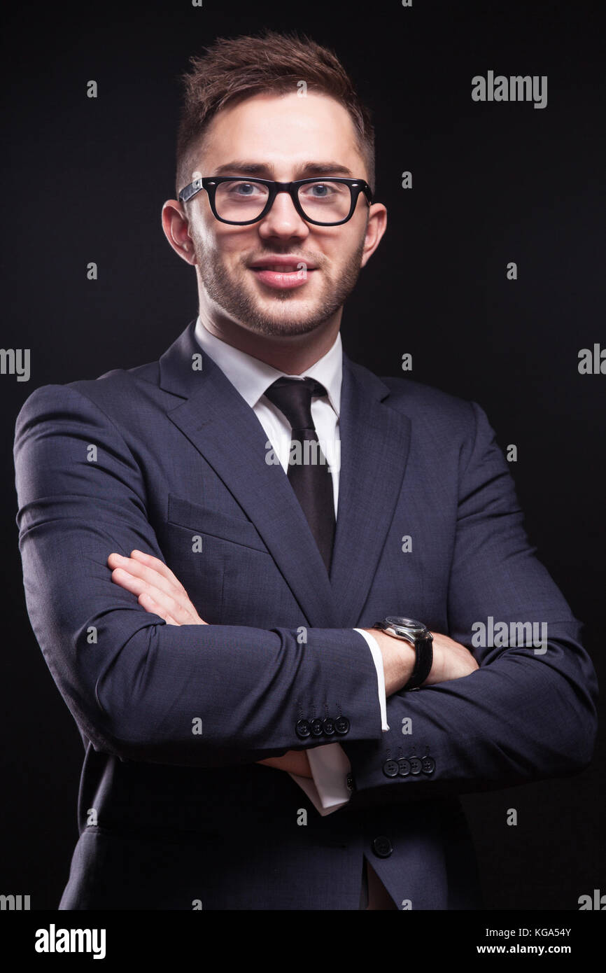 Picture of serious businessman standing Stock Photo - Alamy