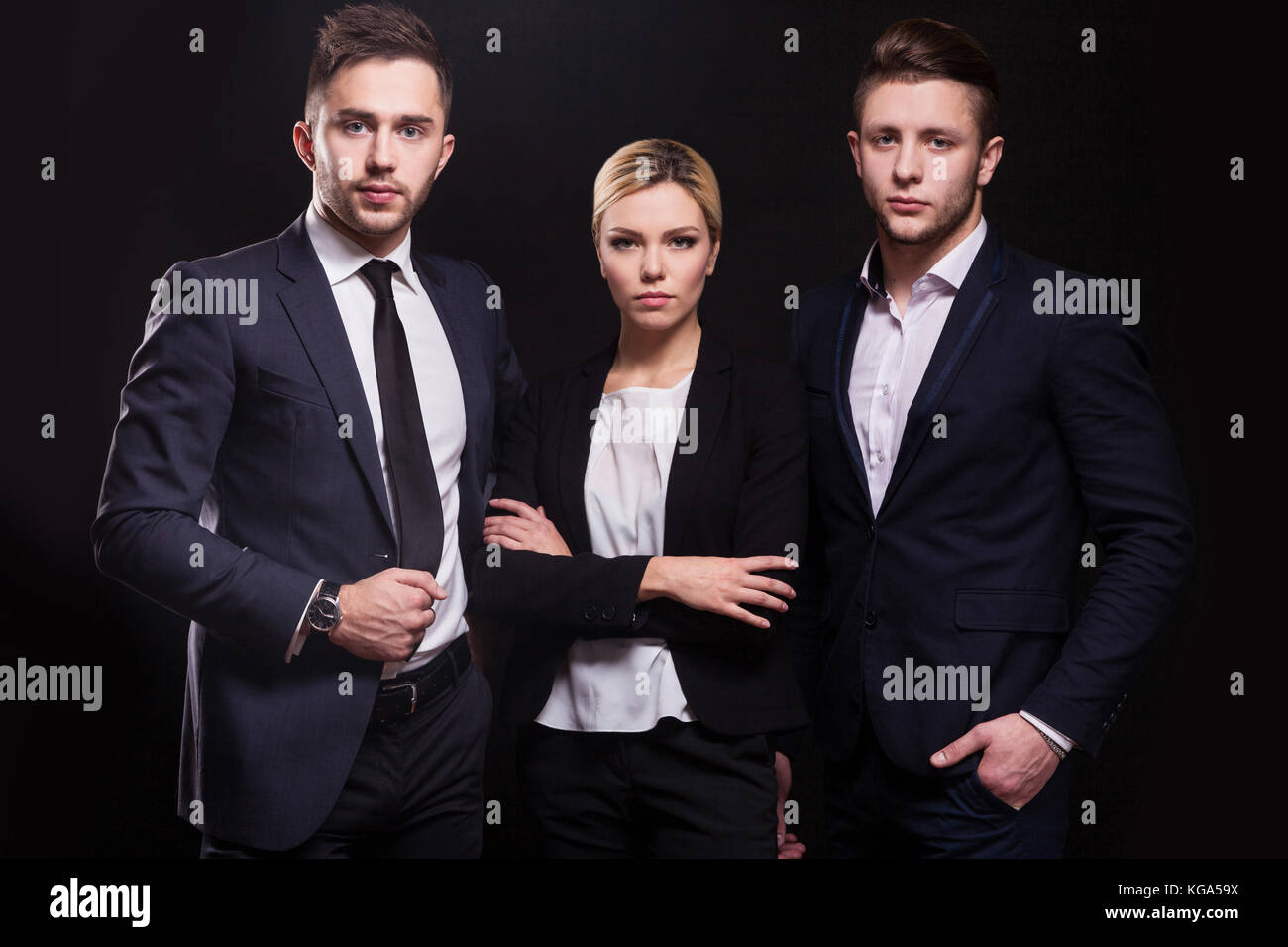 Picture of young trio of office workers standing Stock Photo - Alamy