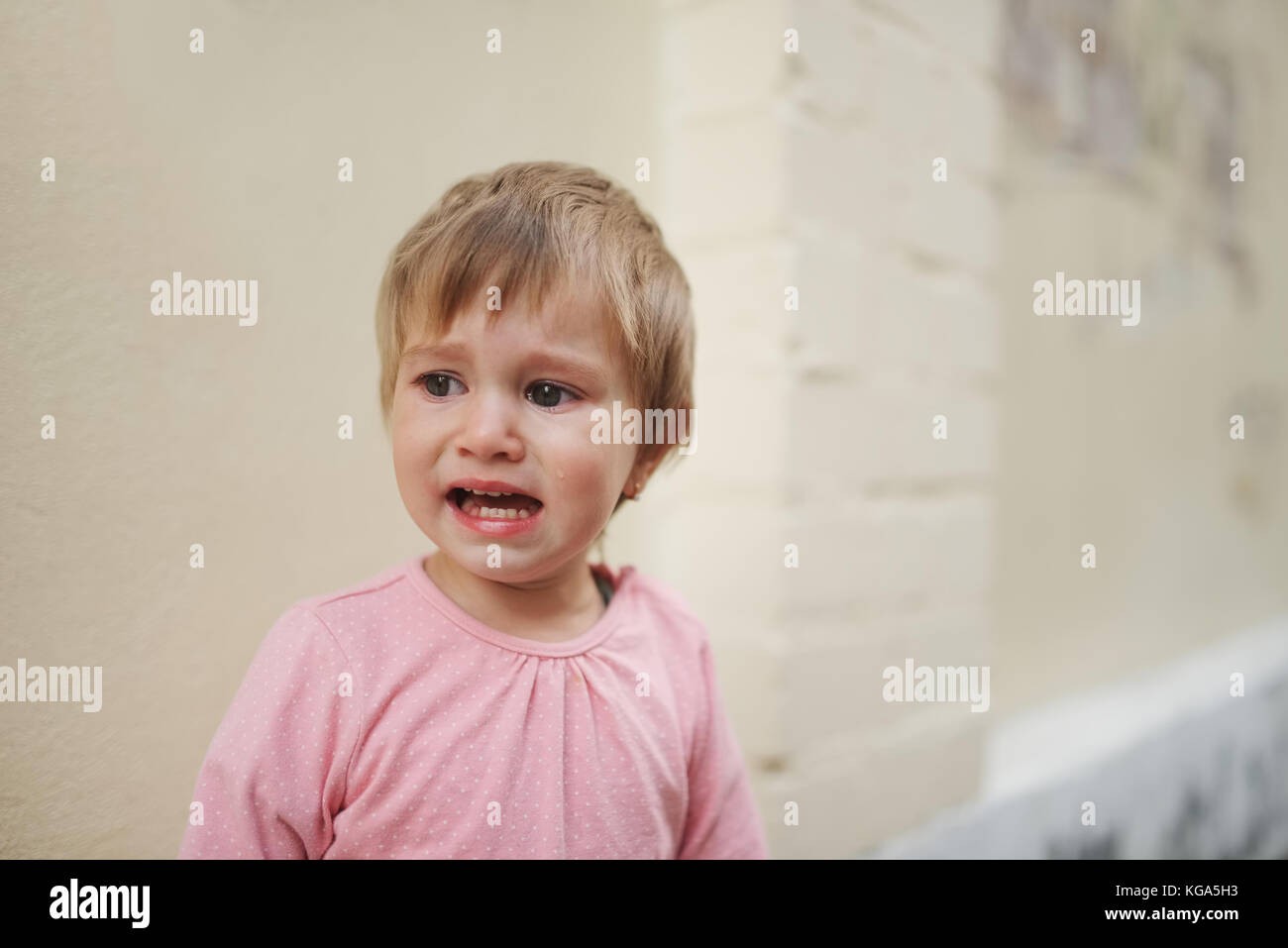 portrait of cute unhappy crying girl outdoors Stock Photo - Alamy