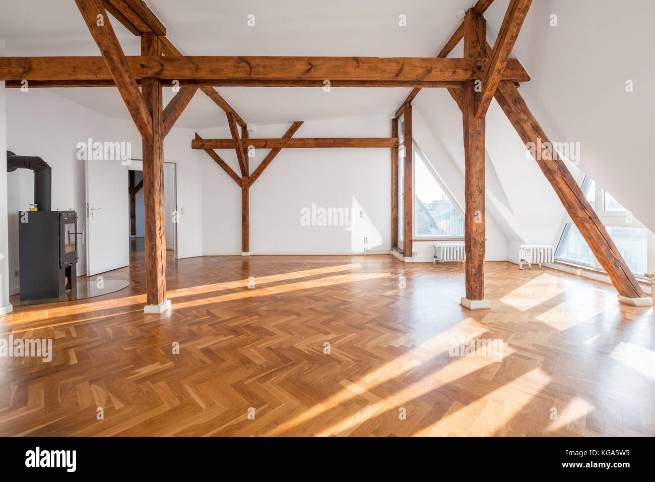 empty loft room with fireplace and wooden beams Stock Photo - Alamy