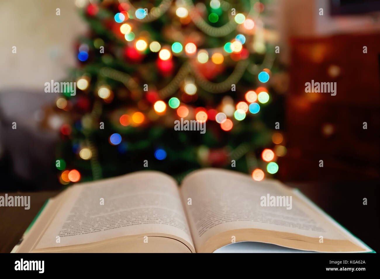 Christmas and bible with blurred candles light background Stock Photo ...