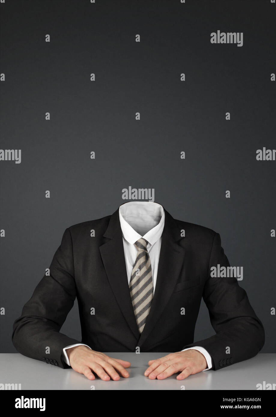 Businessman without head on dark background with copy-space Stock Photo ...
