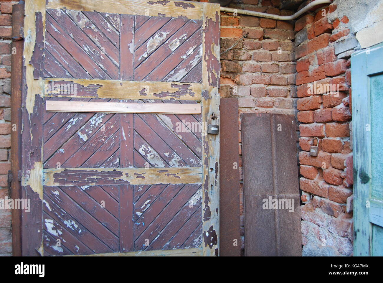 Old styled building with rustic looking door Stock Photo - Alamy