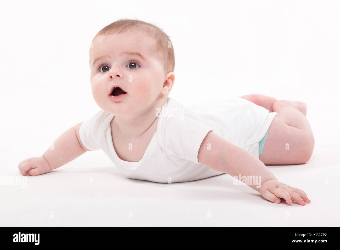 baby in the body lying on his stomach on a white background and Stock ...