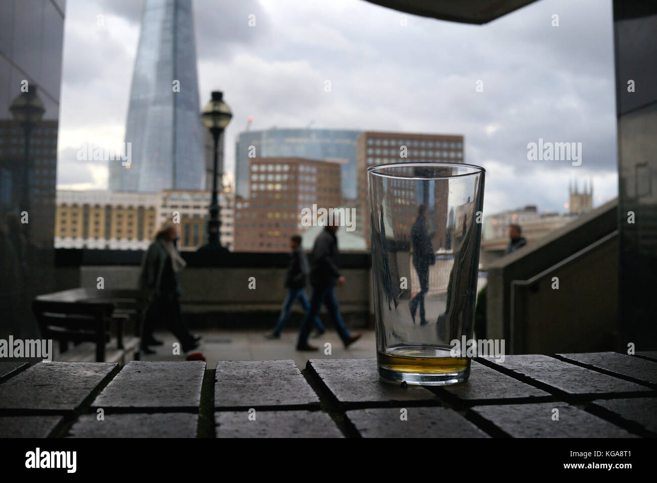 A pint glass by the side of the River Thames, London Stock Photo - Alamy