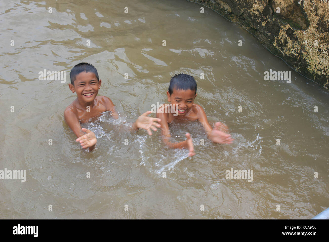 1 October, 2011 - Bangkok, Thailand:Boys playing in Chaopraya river ...