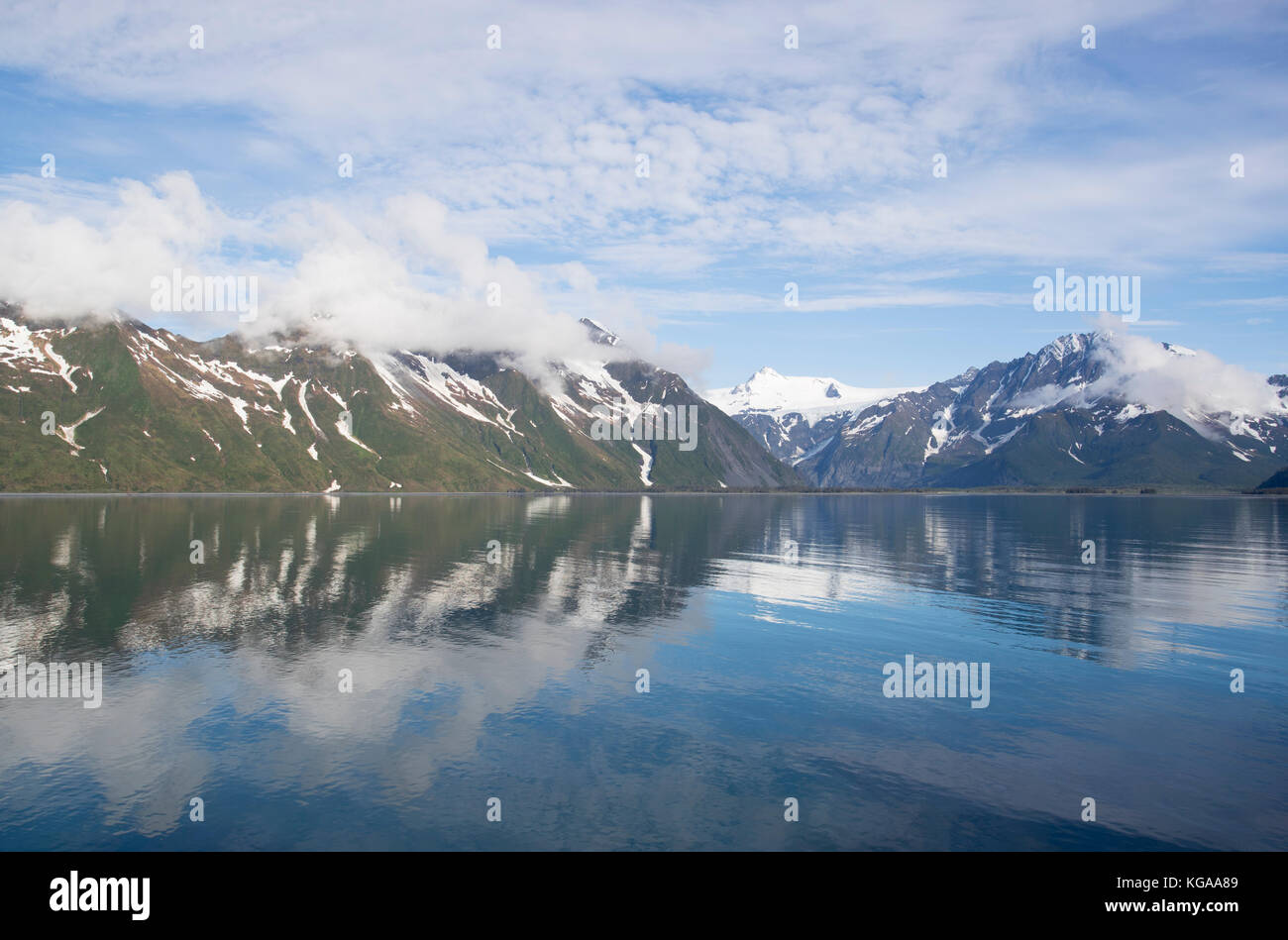 Mountains and reflections on water, Alaska Stock Photo - Alamy