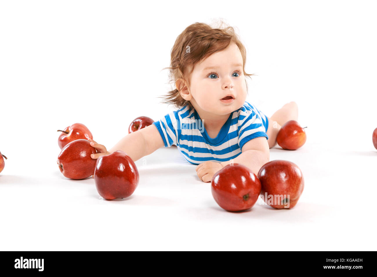 kid with a lot of red apples Stock Photo - Alamy