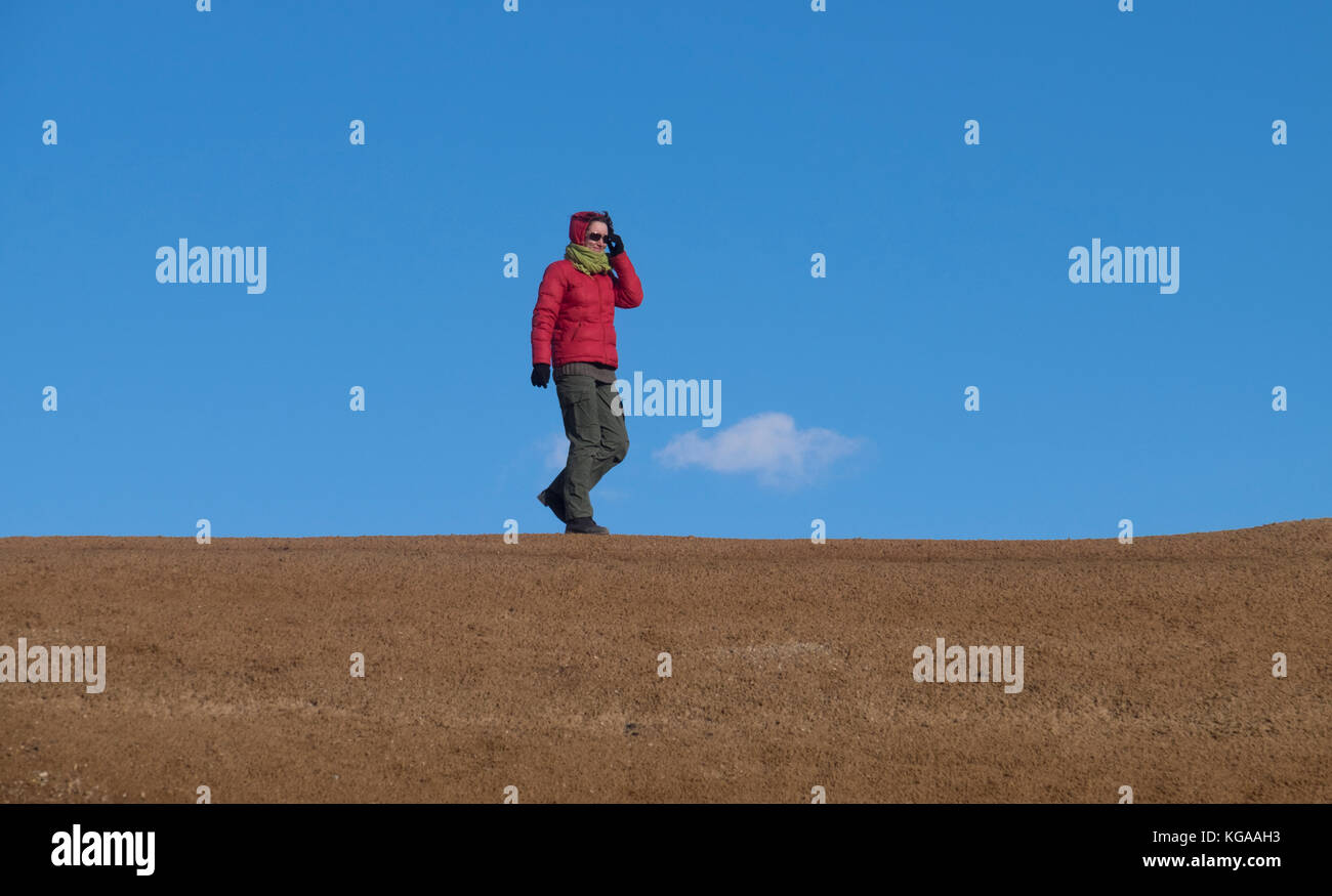 Young woman walking alone Stock Photo - Alamy